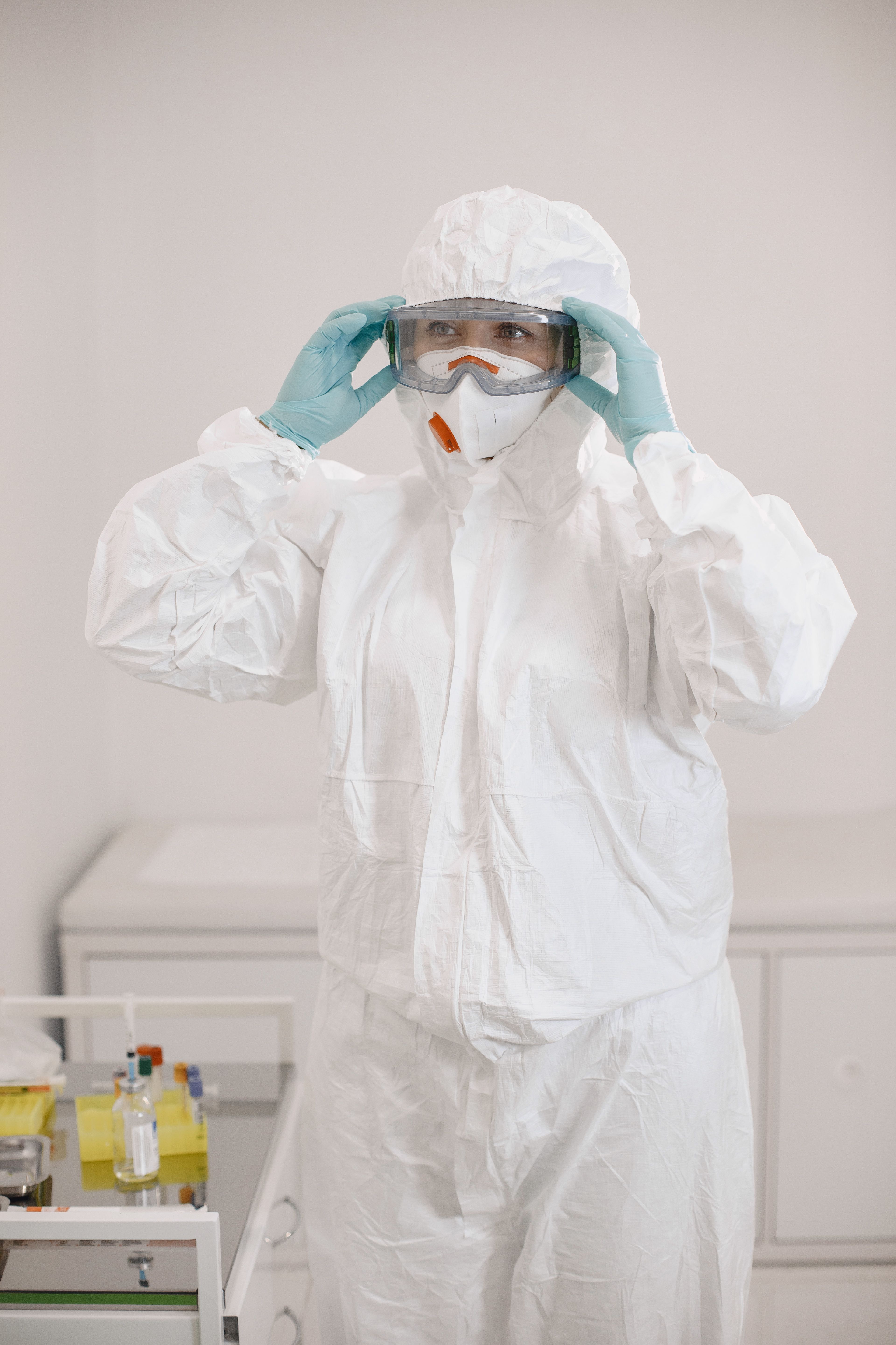 Laboratory Technician in Protective Clothing Fixing Goggles · Free ...