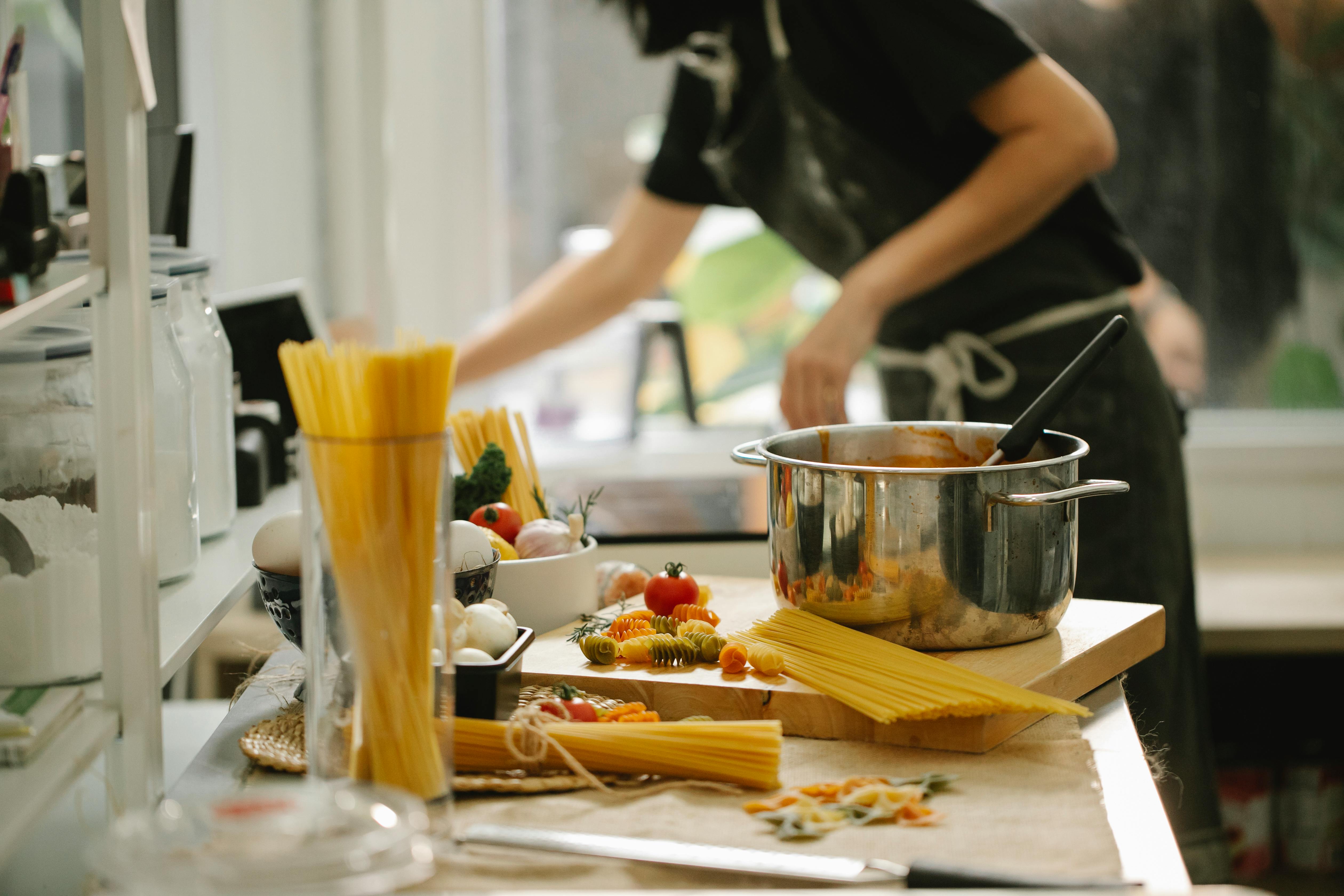 Woman Eating on Cooking Pan · Free Stock Photo
