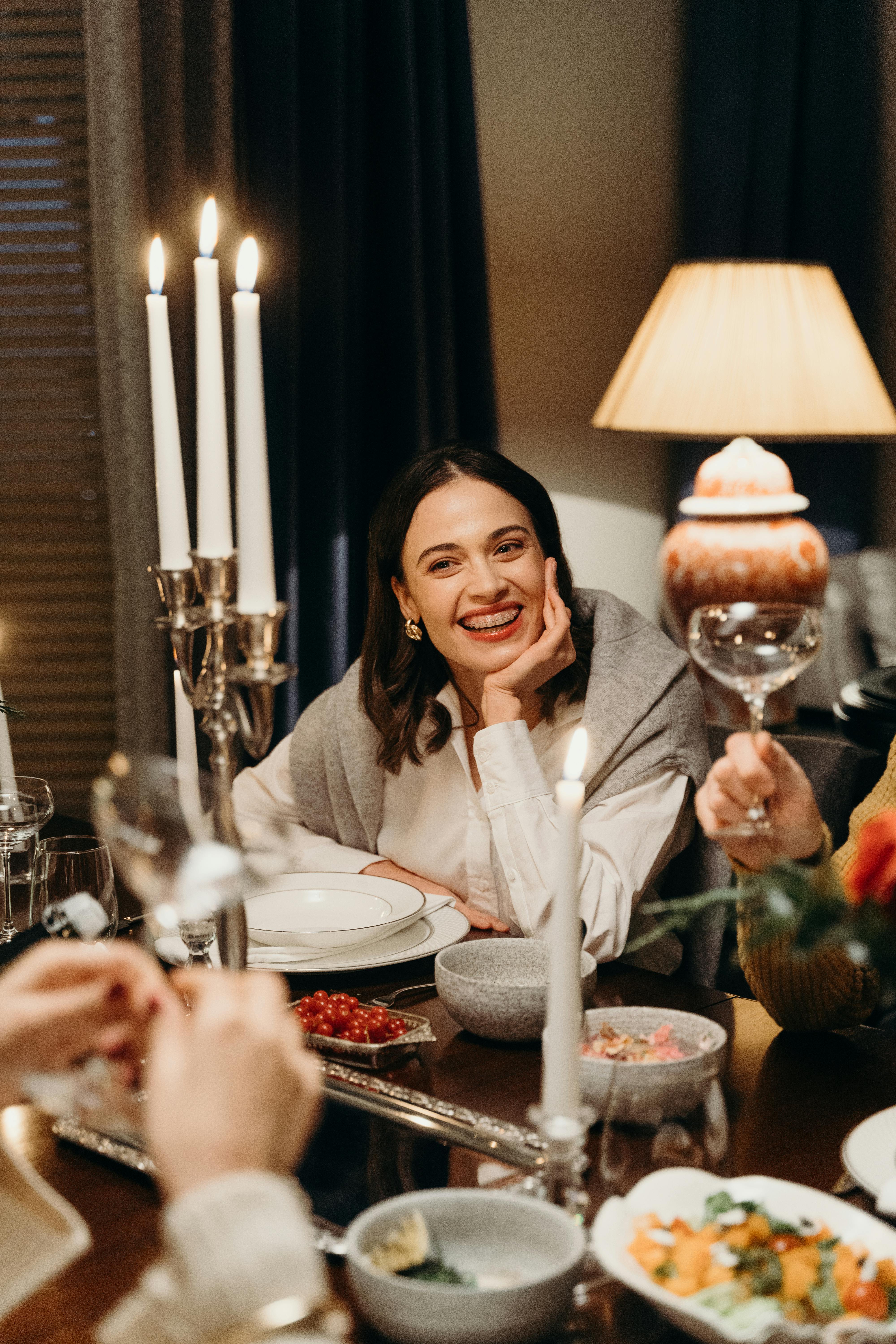 A Woman Sitting at the Dining Table · Free Stock Photo