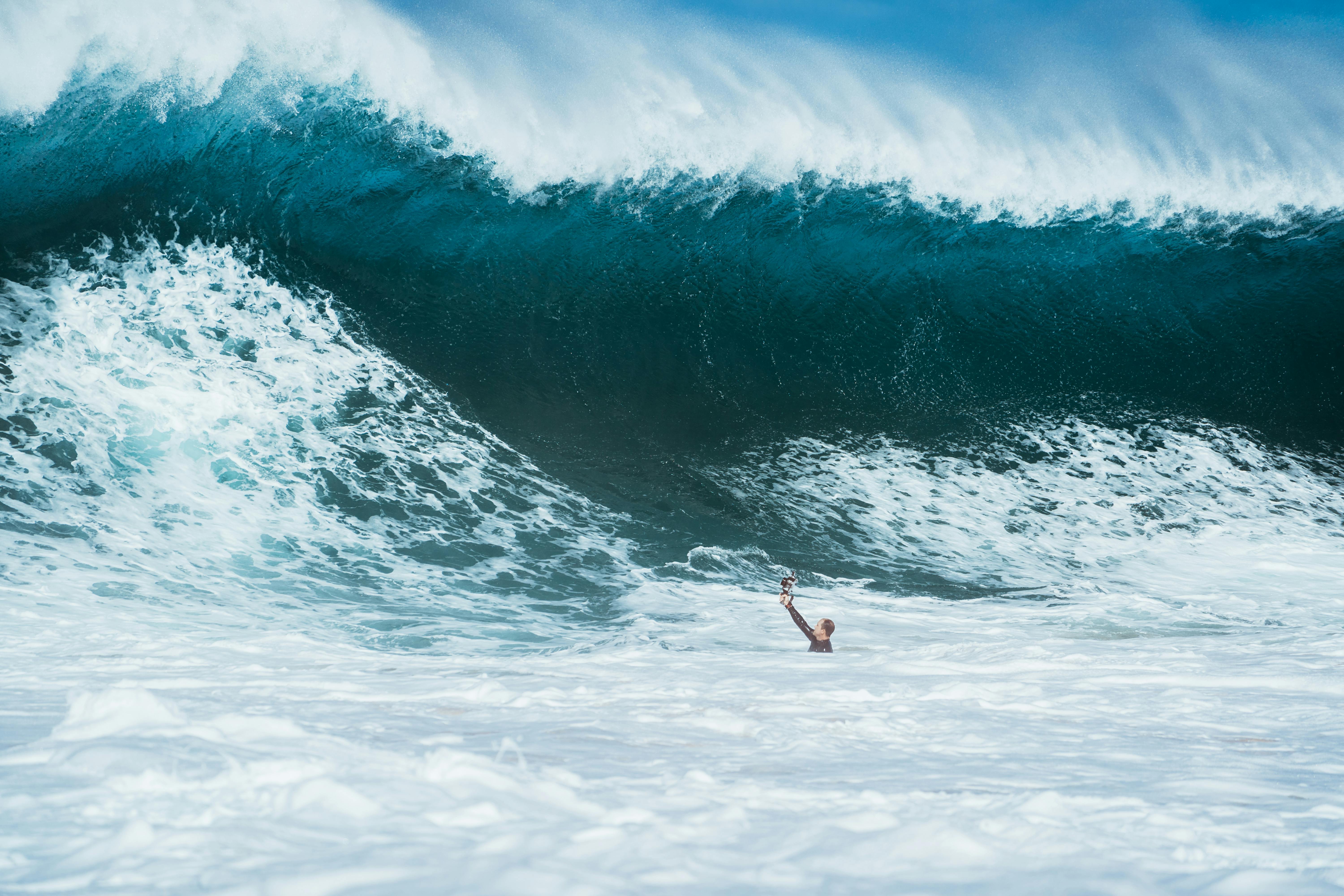 Anonymous person in waving sea · Free Stock Photo