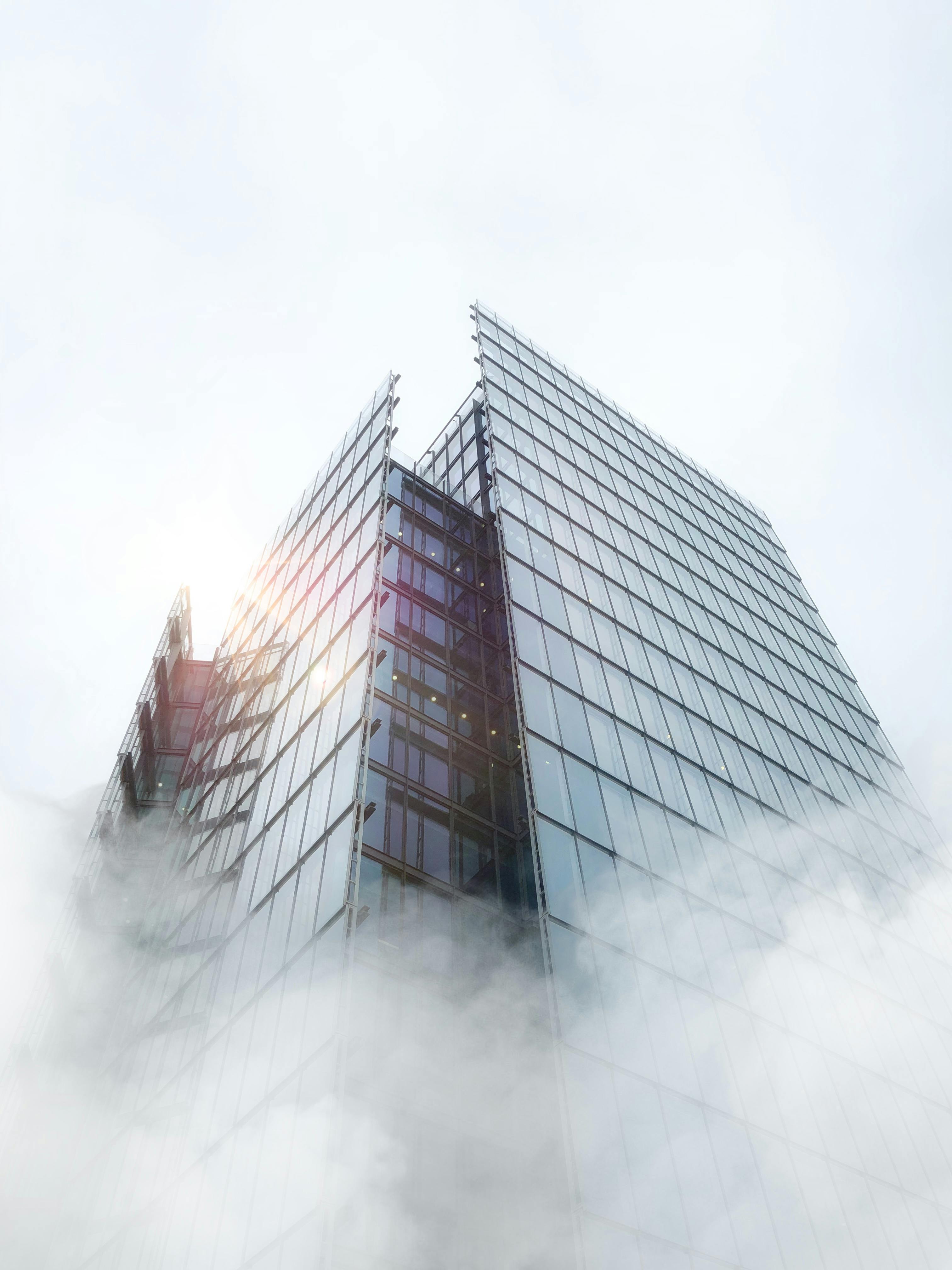 High Rise Glass Building Under Blue Sky · Free Stock Photo