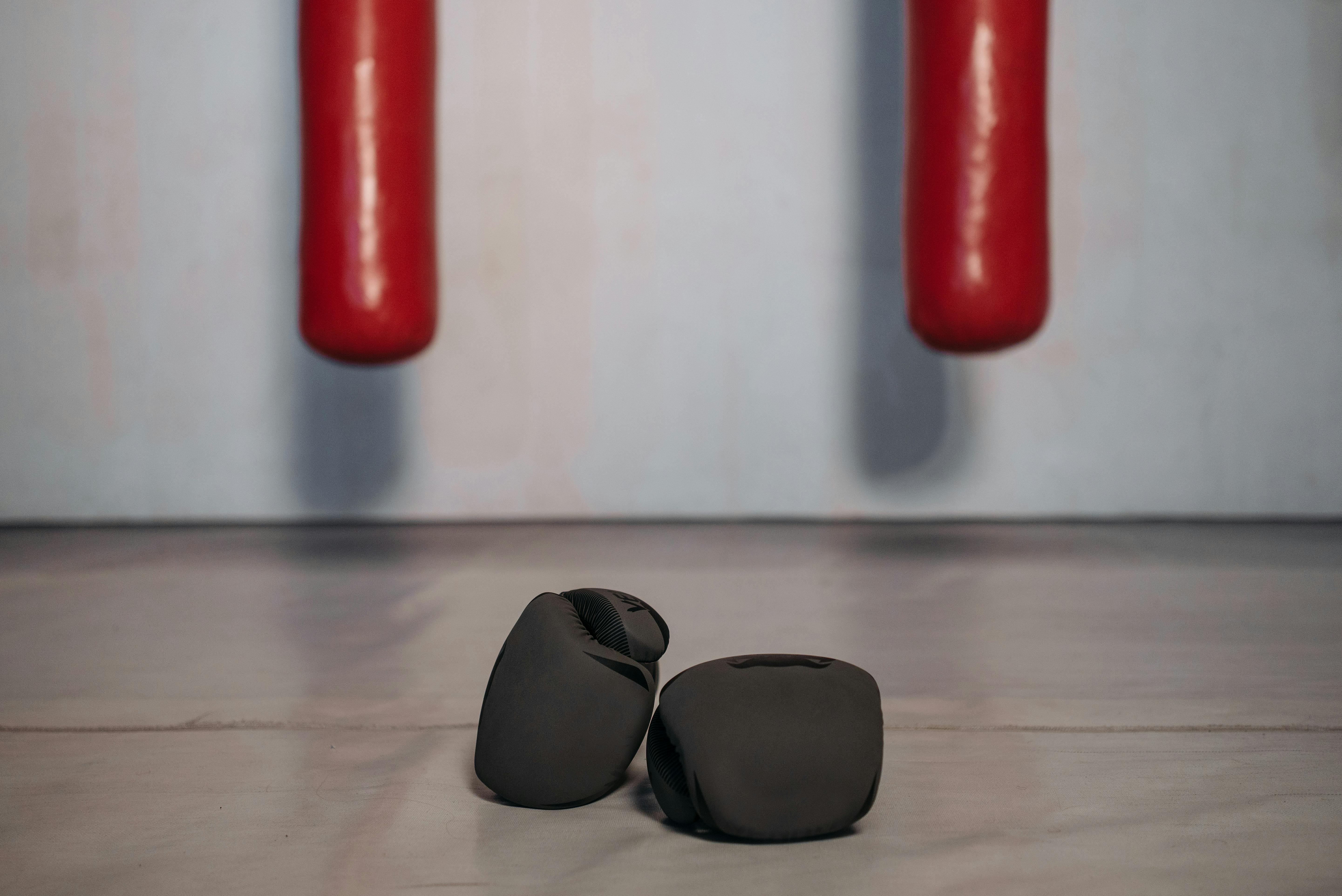 Black Boxing Gloves on the Floor · Free Stock Photo