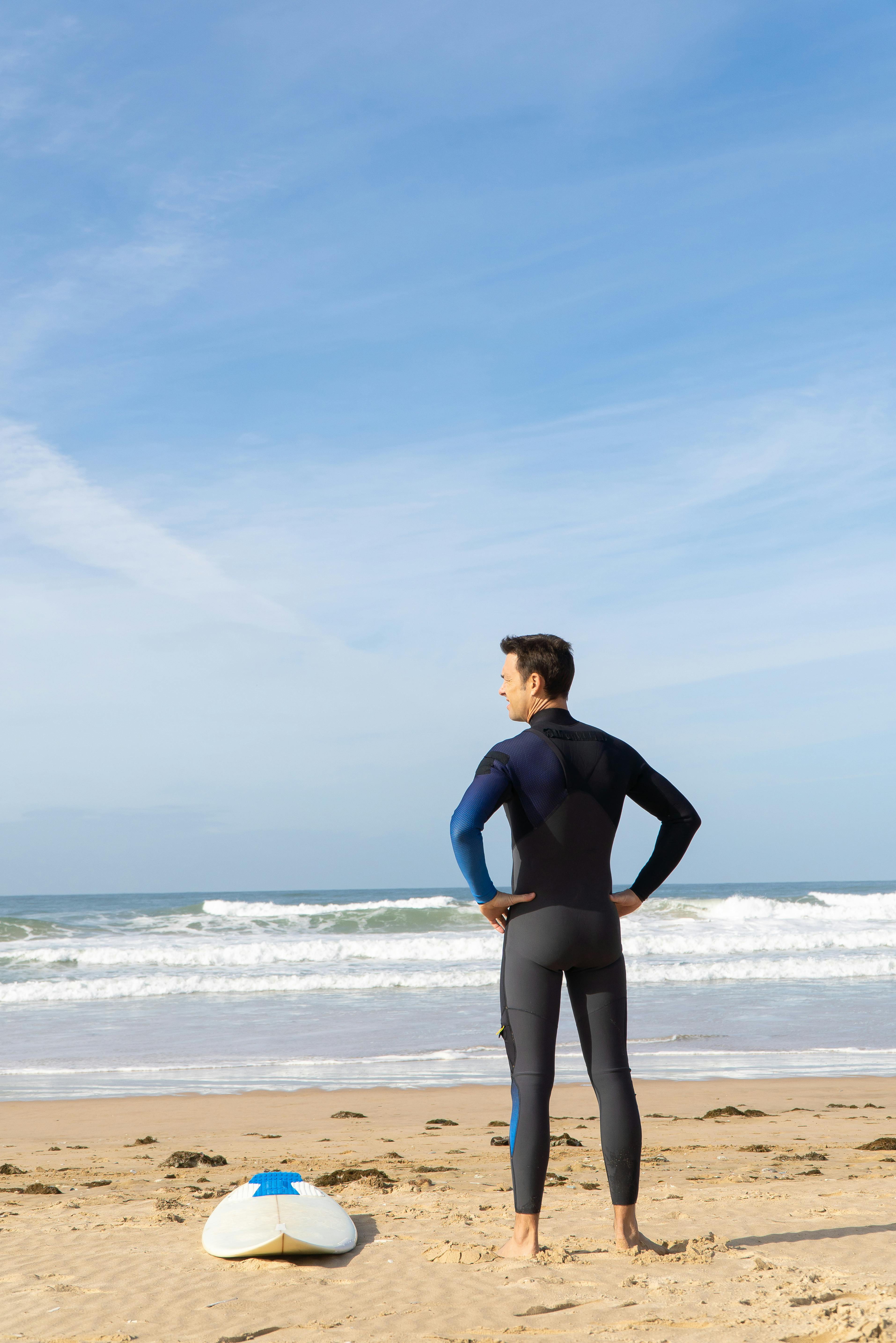 Back View of a Man Standing on the Beach · Free Stock Photo