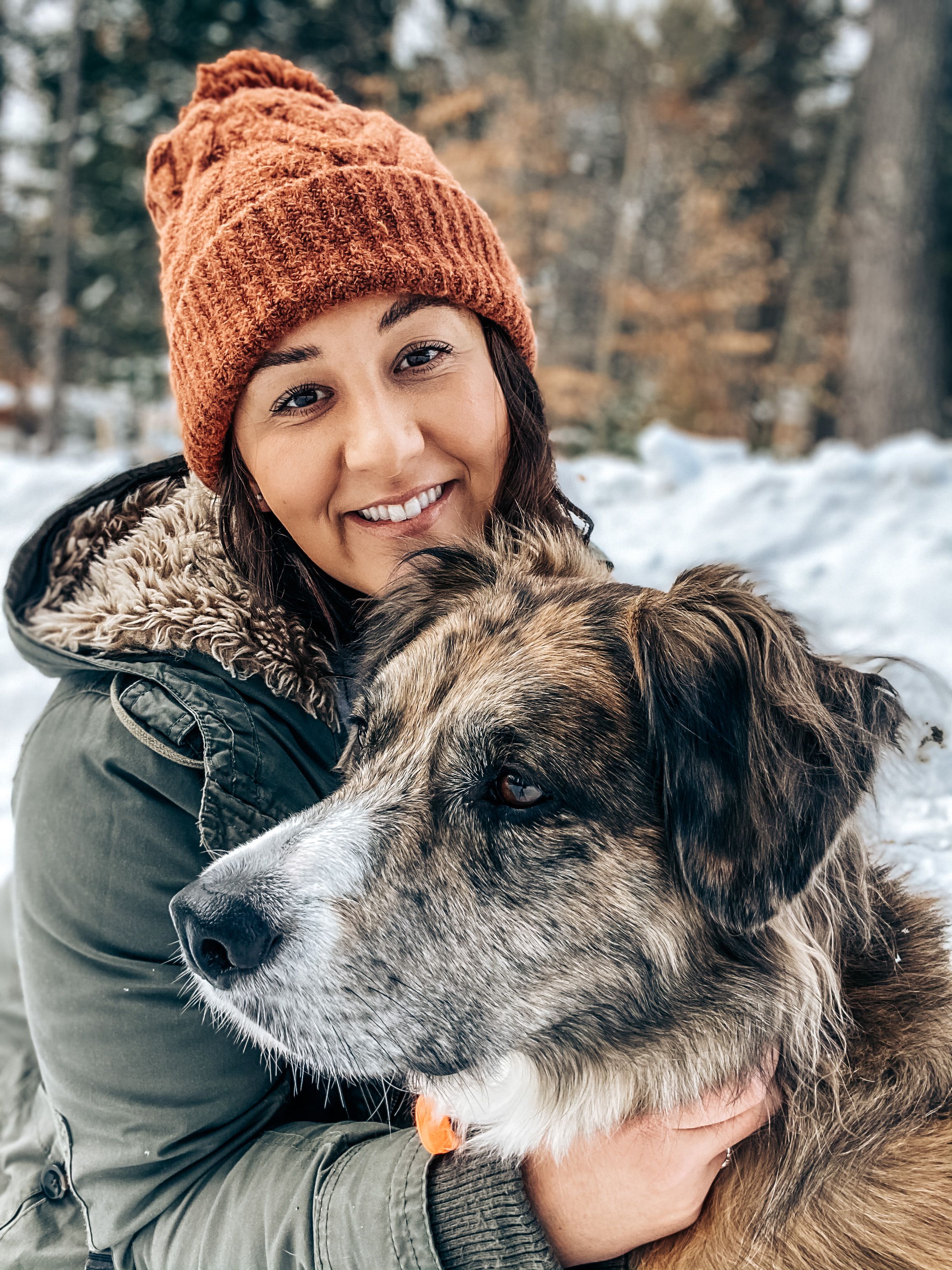 A Happy Woman Posing with Two Dogs · Free Stock Photo