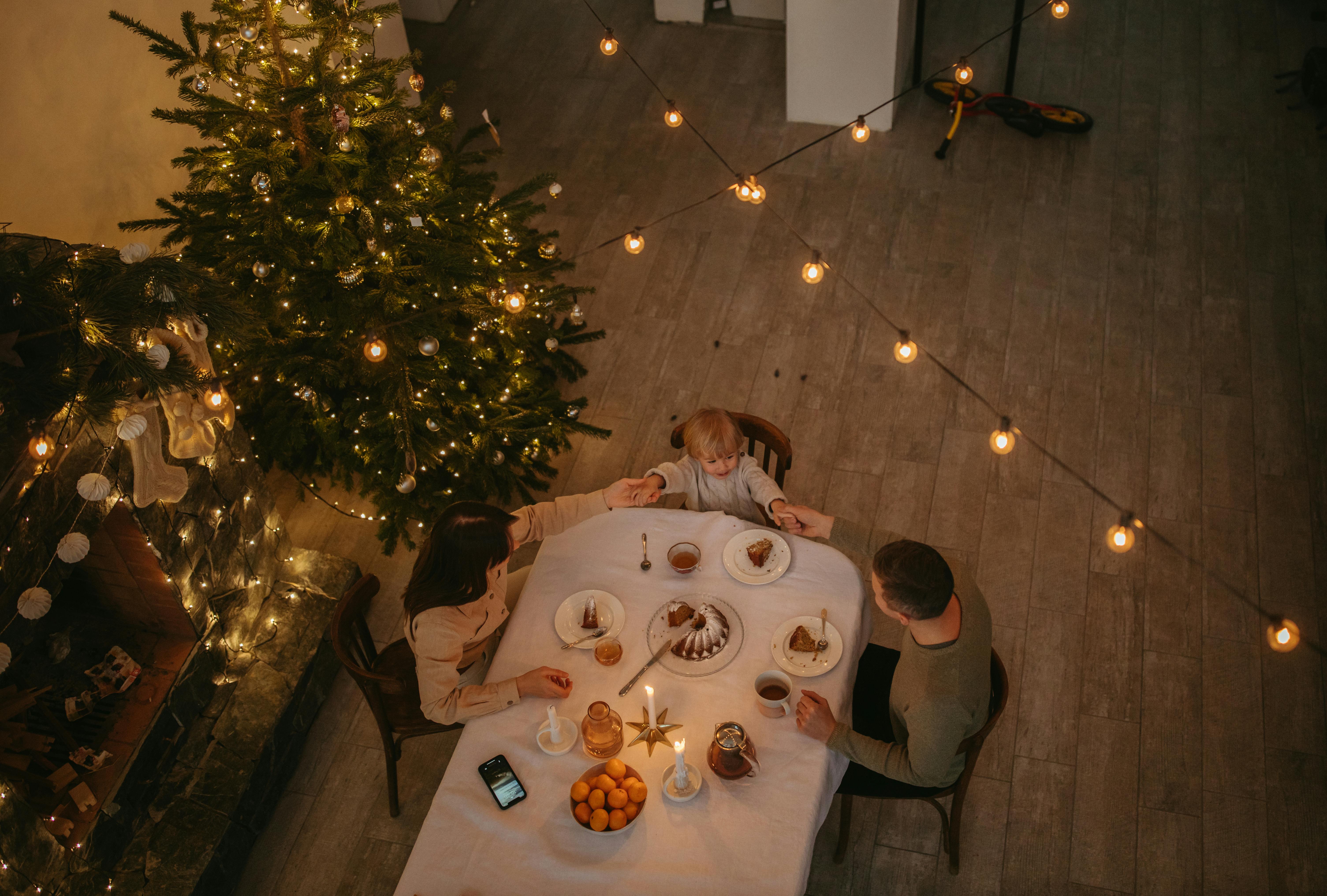 High Angle Shot of People Sitting on Dining Table · Free Stock Photo