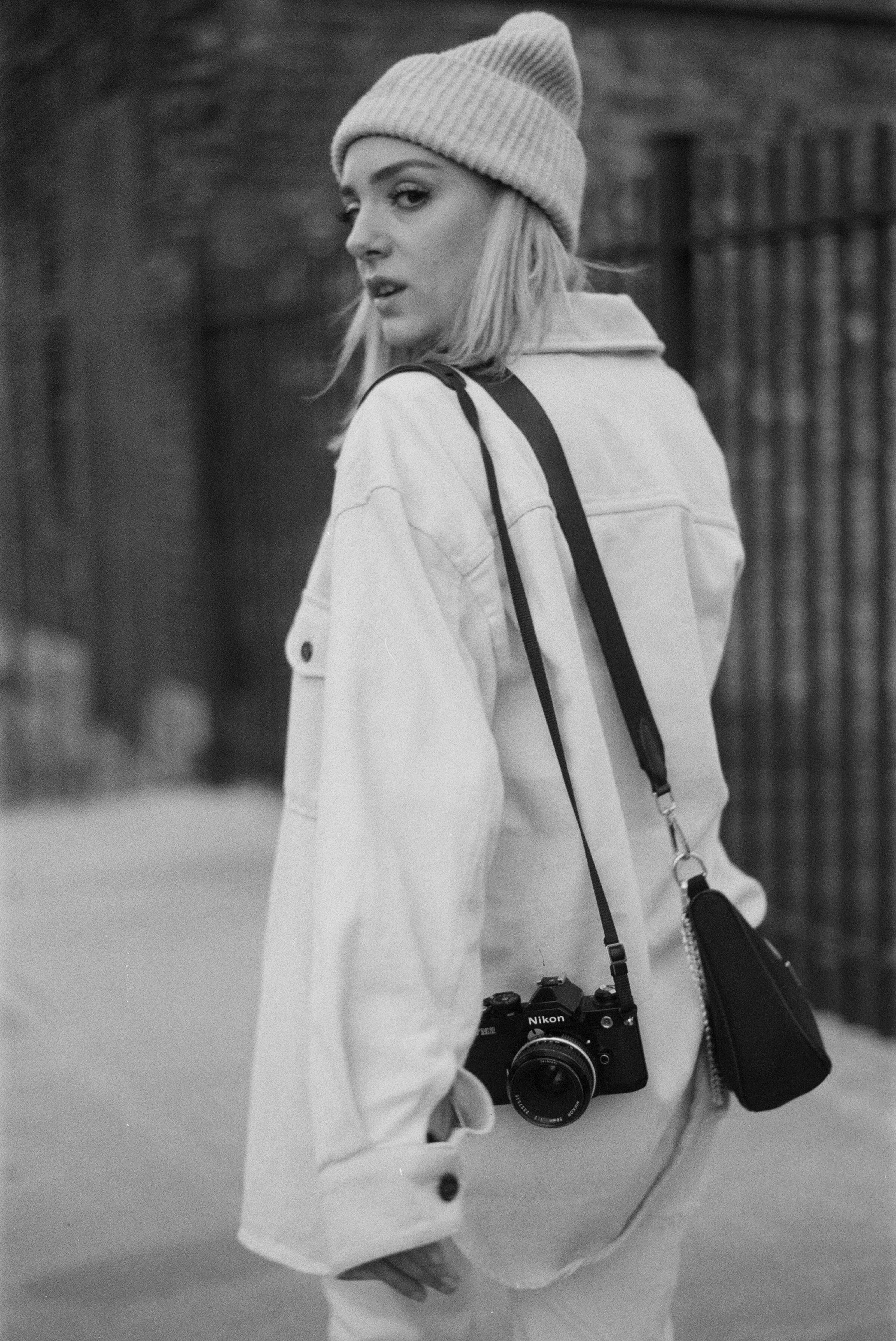 A Female Looking Over a Shoulder at Camera During Photo Shoot · Free ...