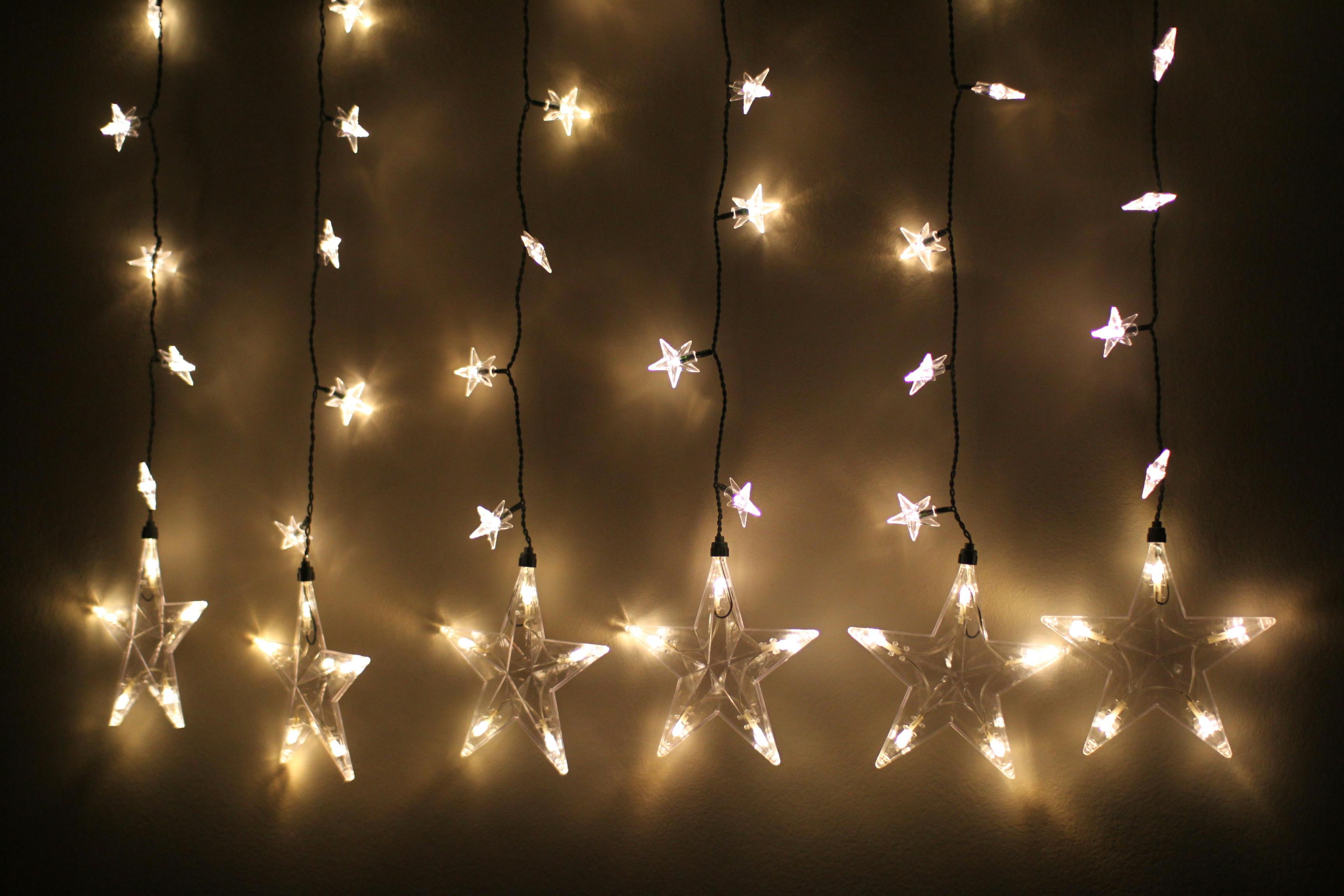 Hanging Christmas White Lights on the Wall · Free Stock Photo