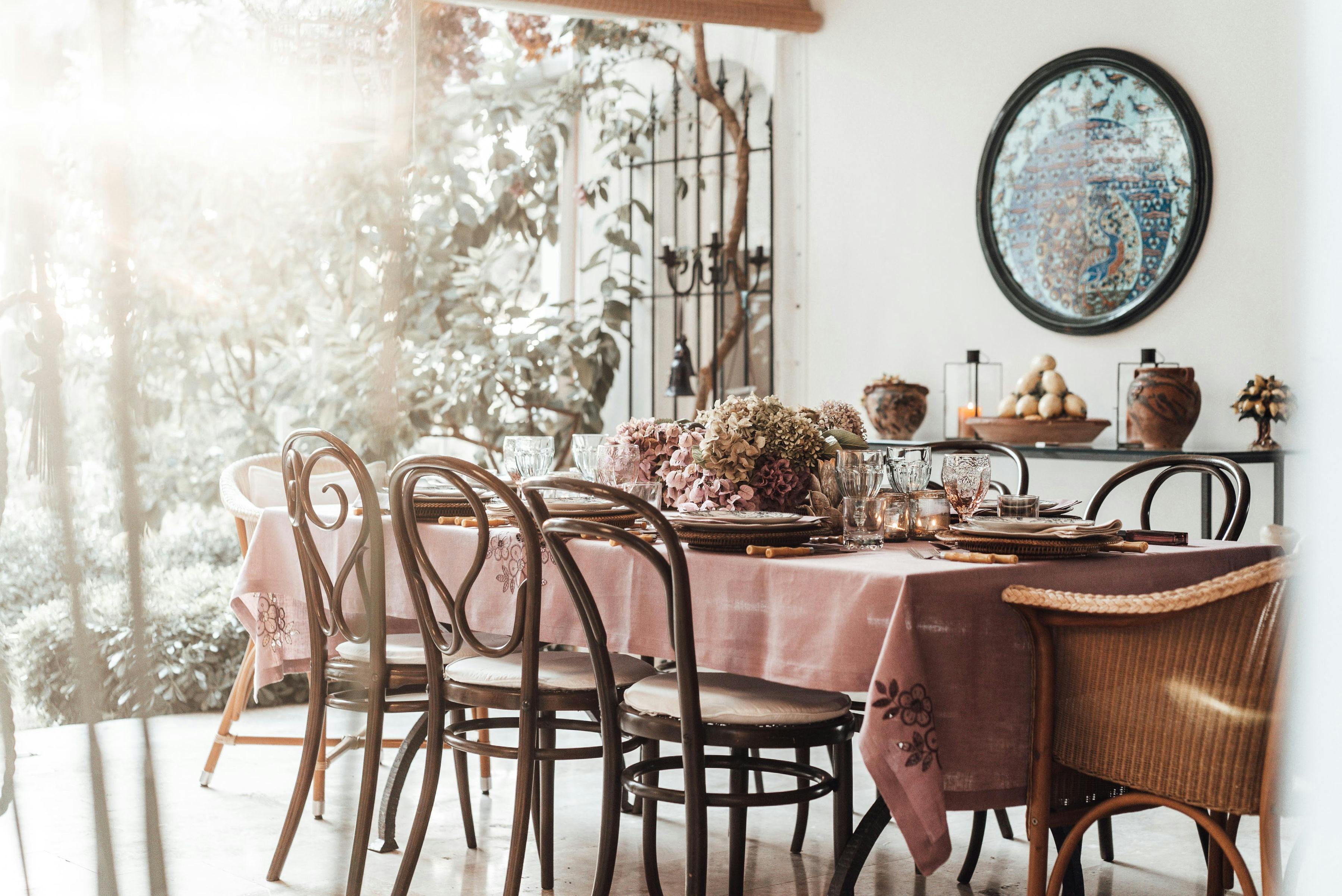 Banquet table with dishware and chairs · Free Stock Photo