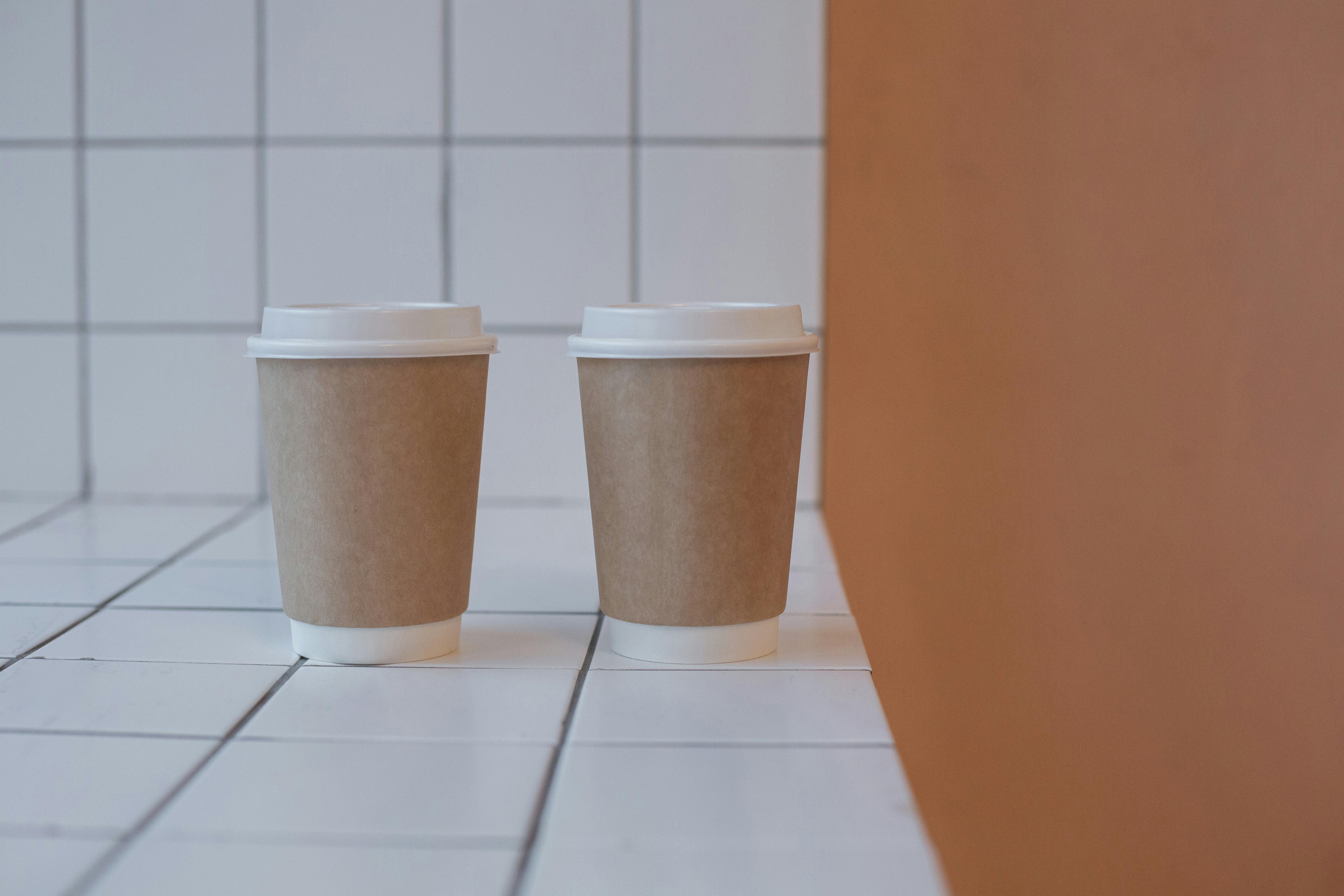 Ceramic Cups on White Tiles · Free Stock Photo