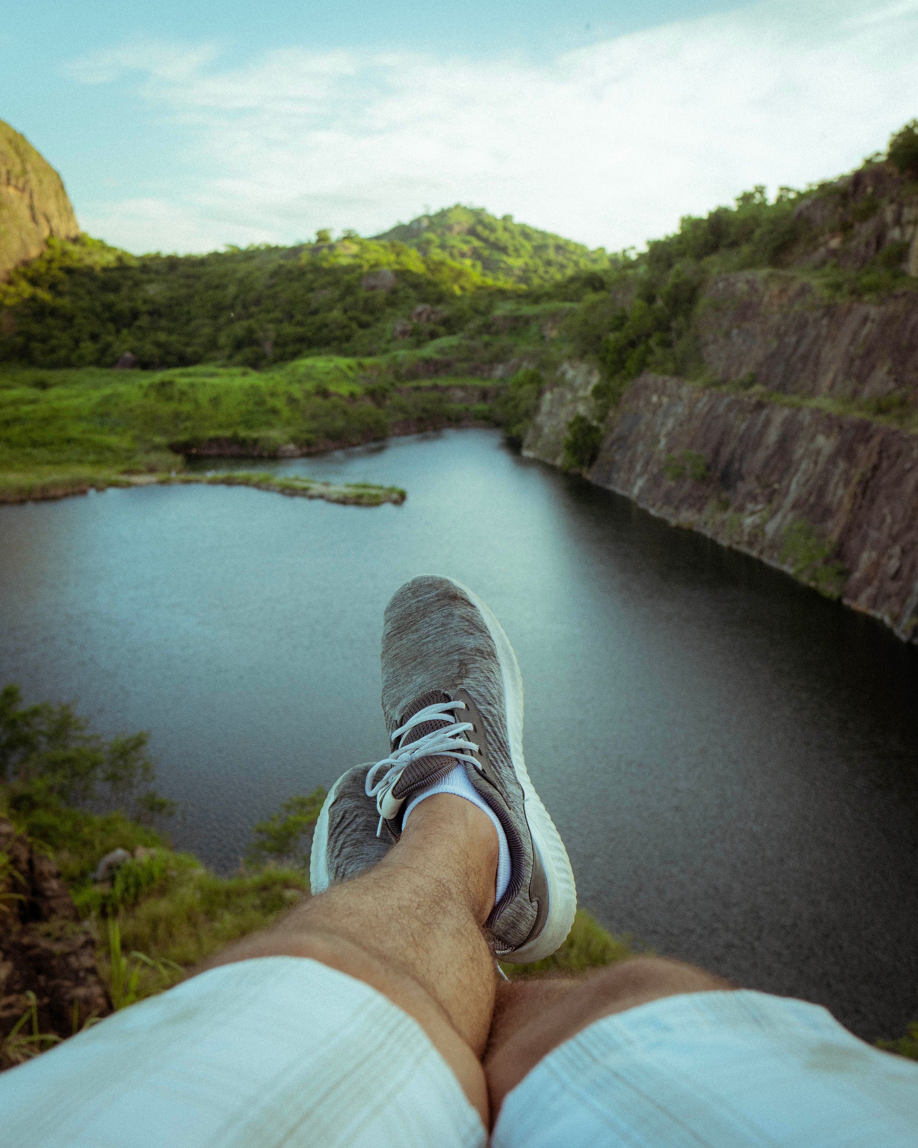Person Standing on a Brown Wood Log Floating on a Body of Water · Free ...