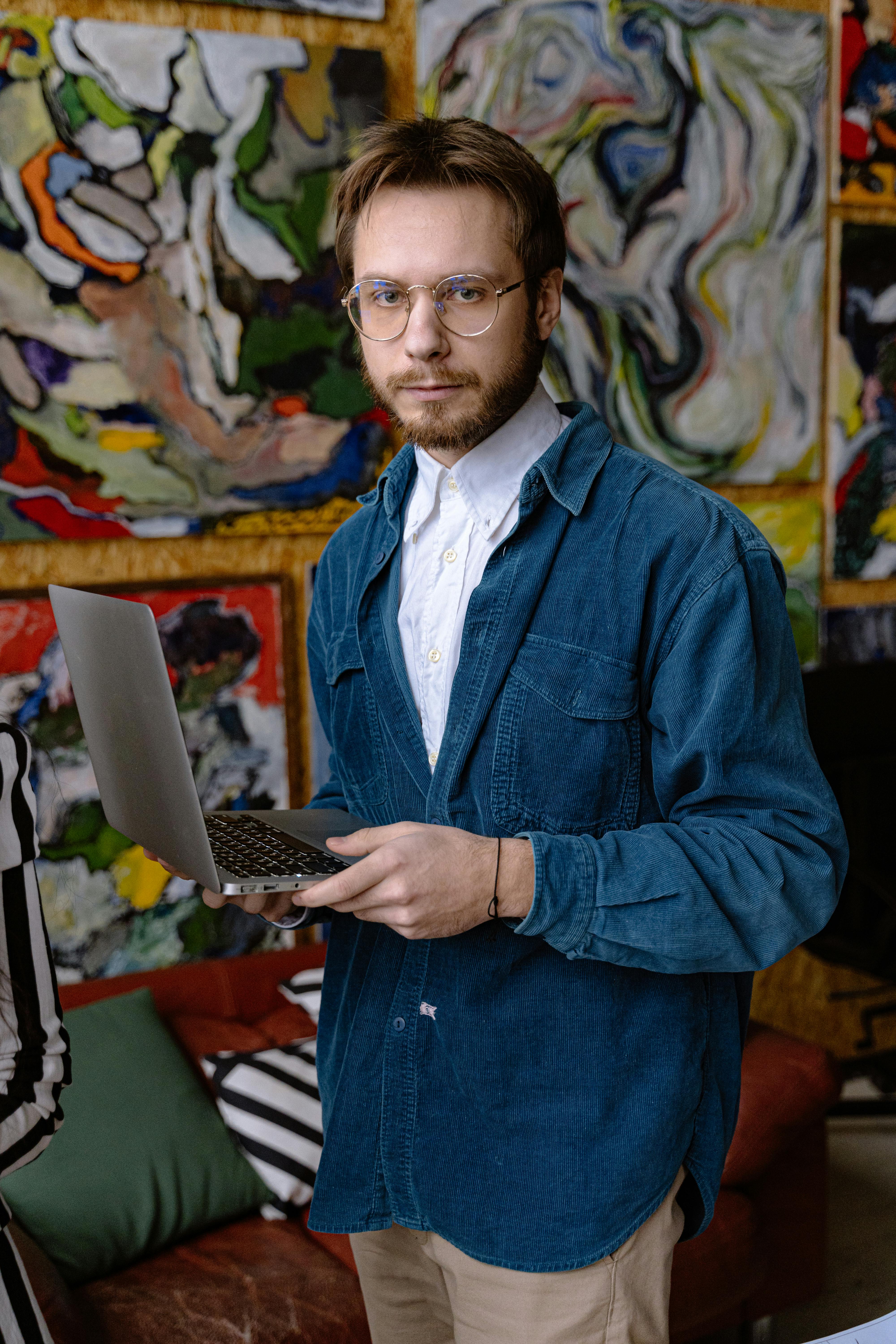 Portrait of Man with Laptop on Art Background · Free Stock Photo