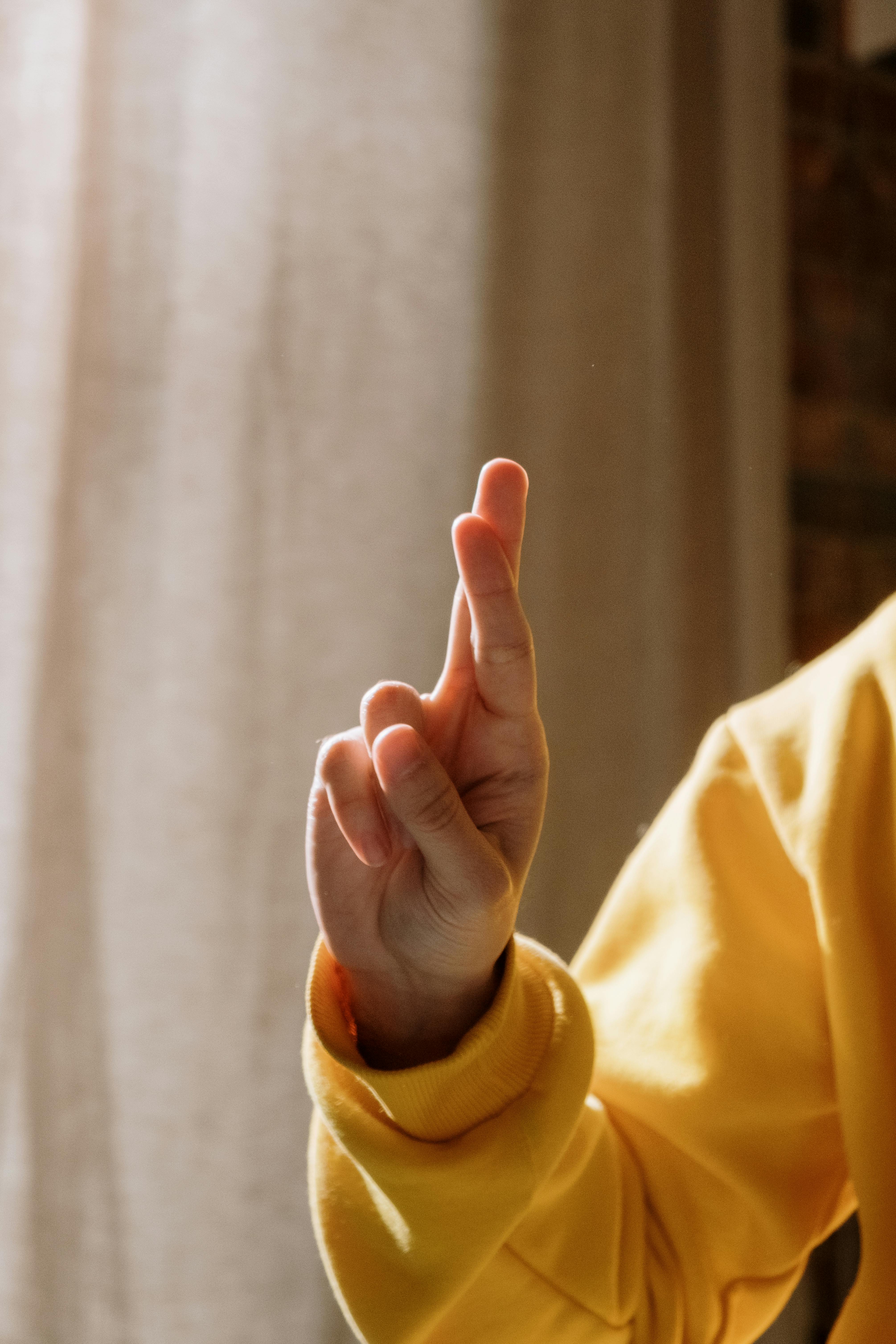 Close Up Shot of a Fingers Crossed · Free Stock Photo