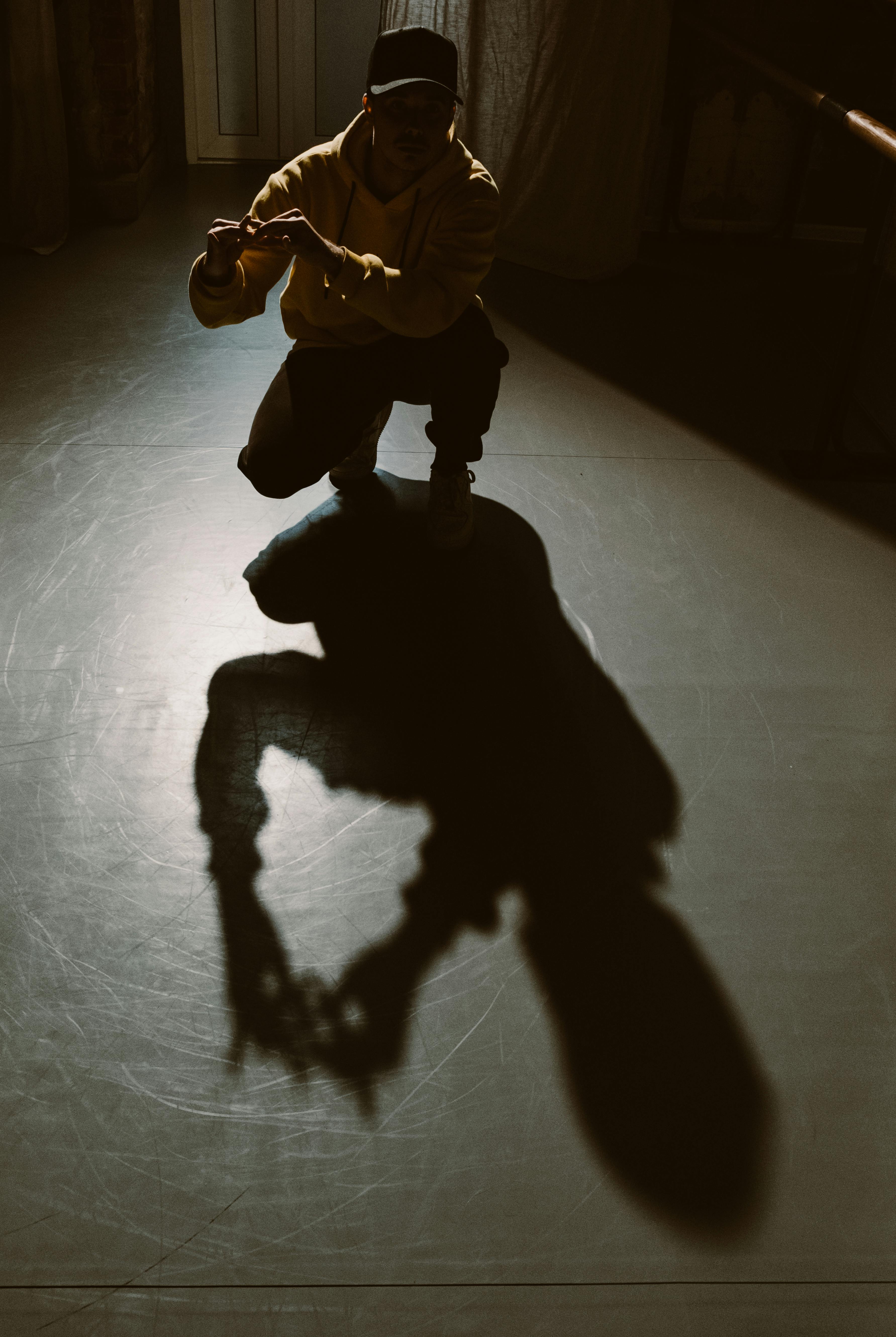 A Man Making Shadows on the Ground · Free Stock Photo