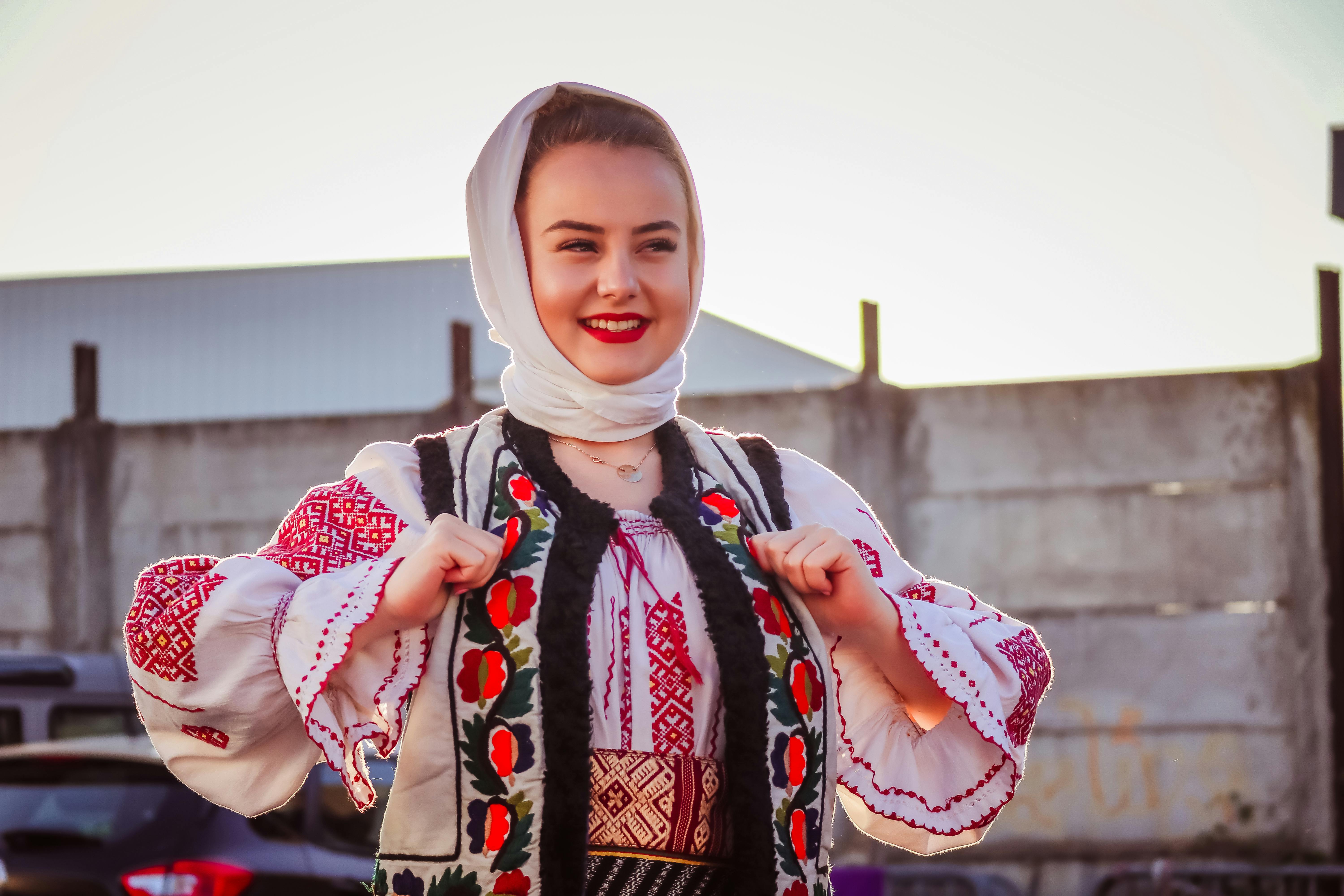 Women with Flowers in Traditional Clothing · Free Stock Photo