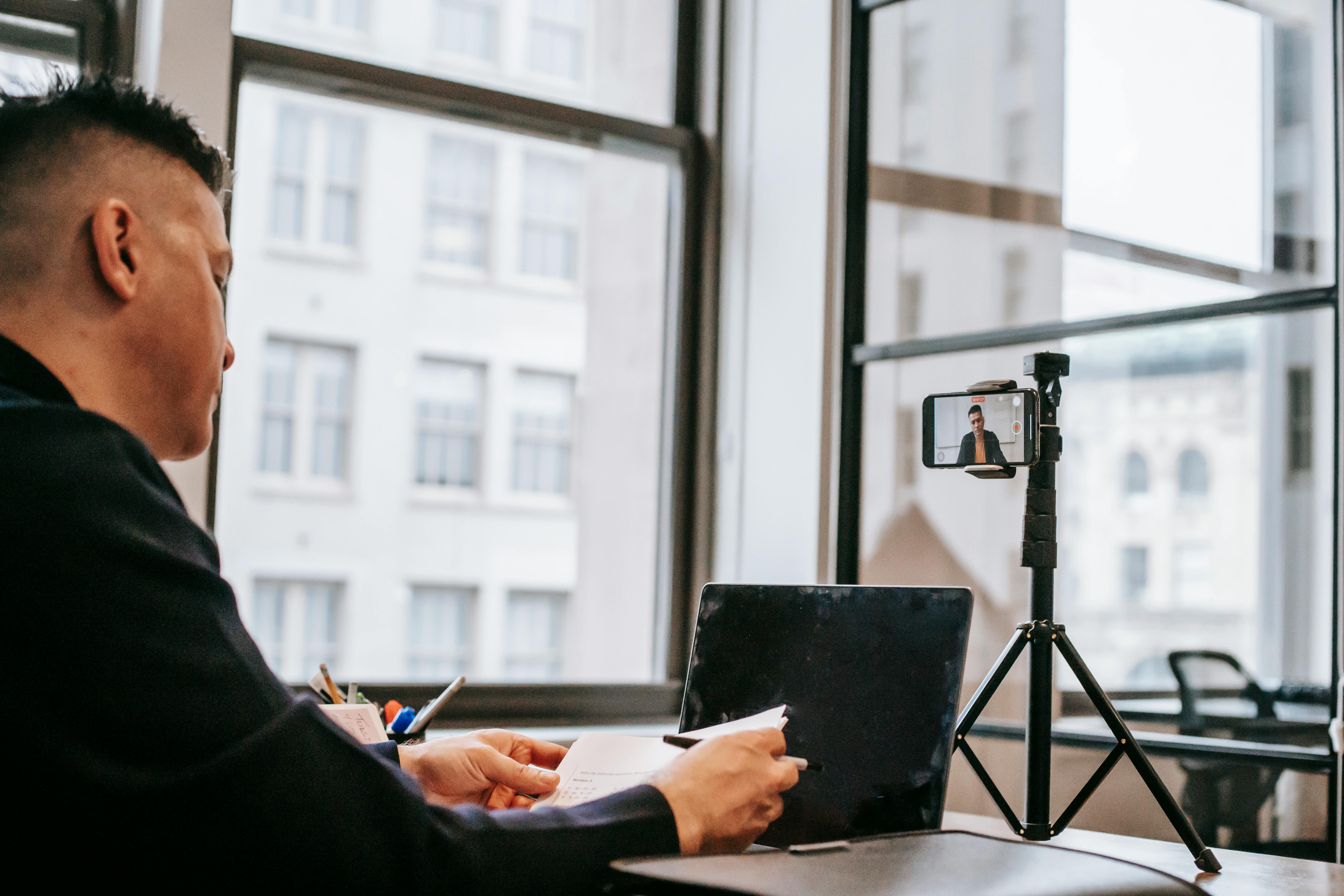 Photo Of Man Looking On Papers · Free Stock Photo
