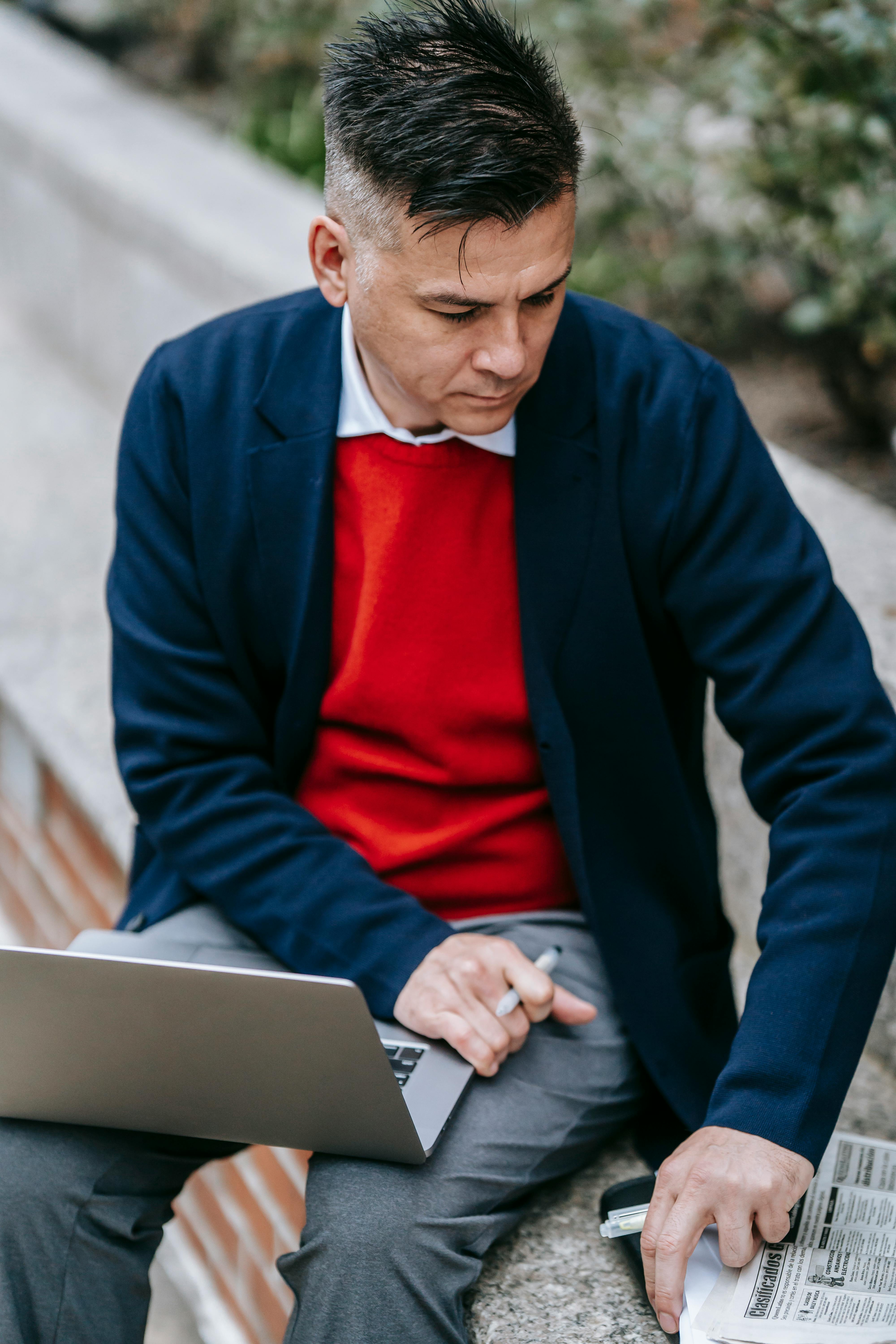 Man Holding Macbook Pro · Free Stock Photo