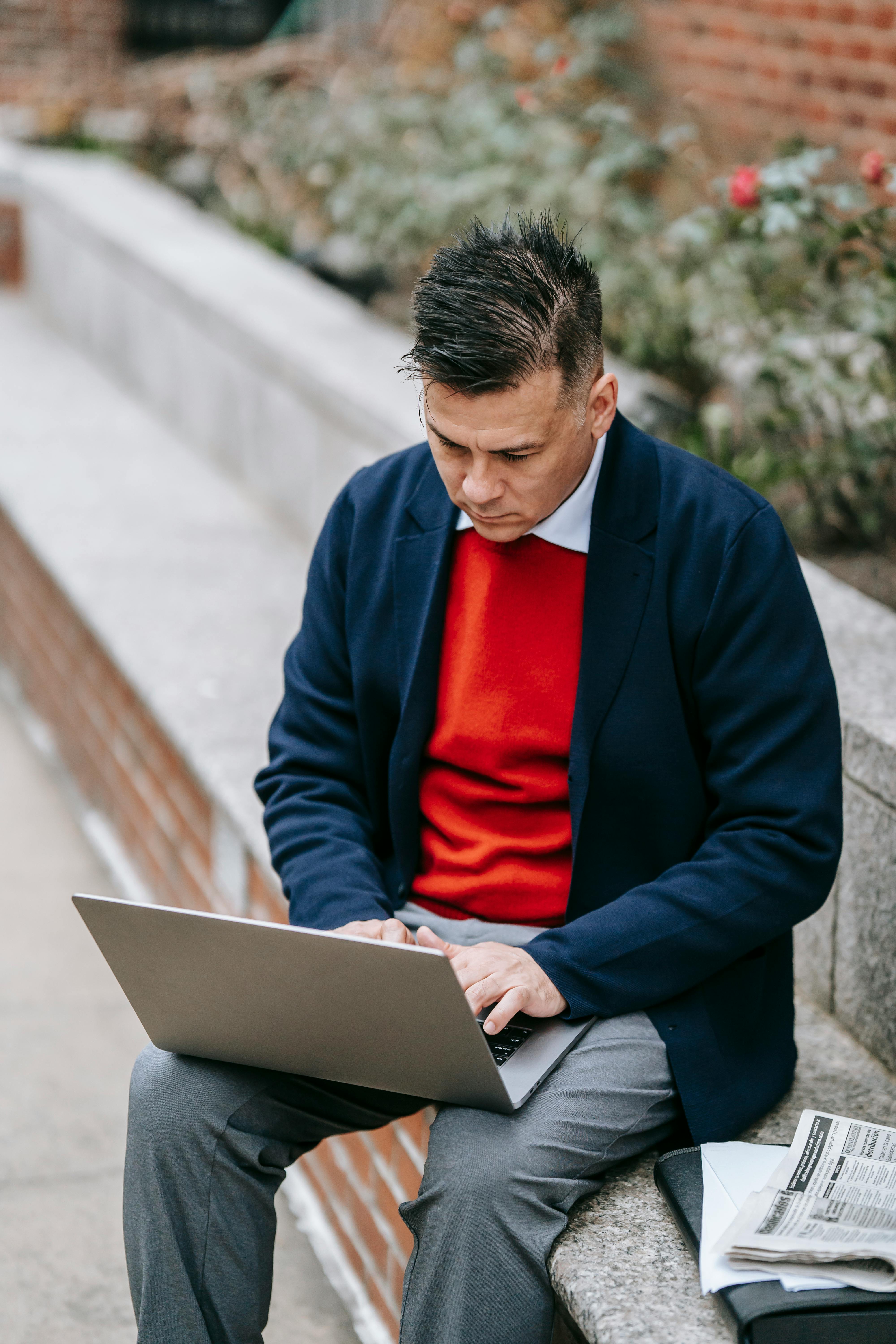 Man Holding Macbook Pro · Free Stock Photo