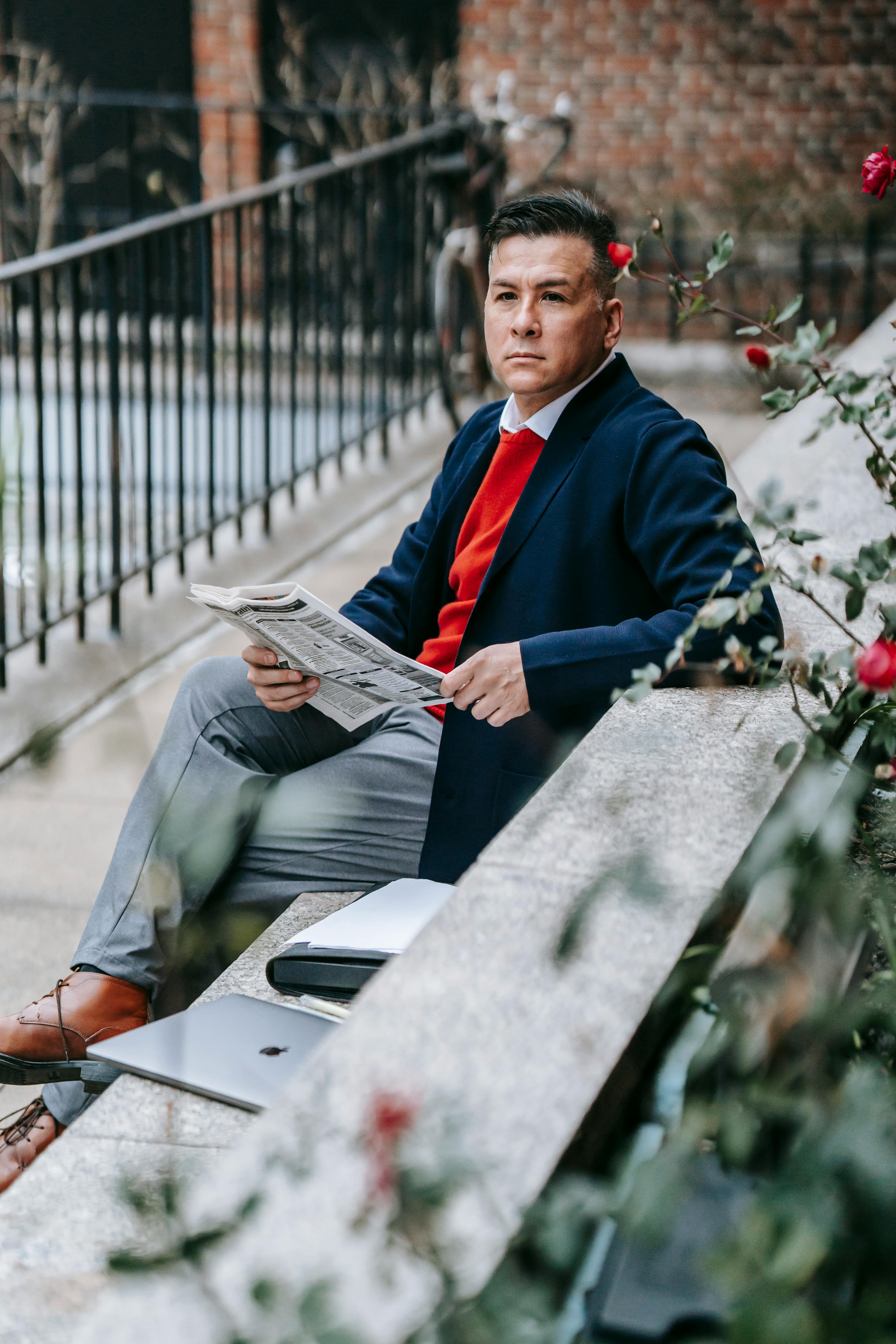 Photo Of Man Sitting Outdoors · Free Stock Photo