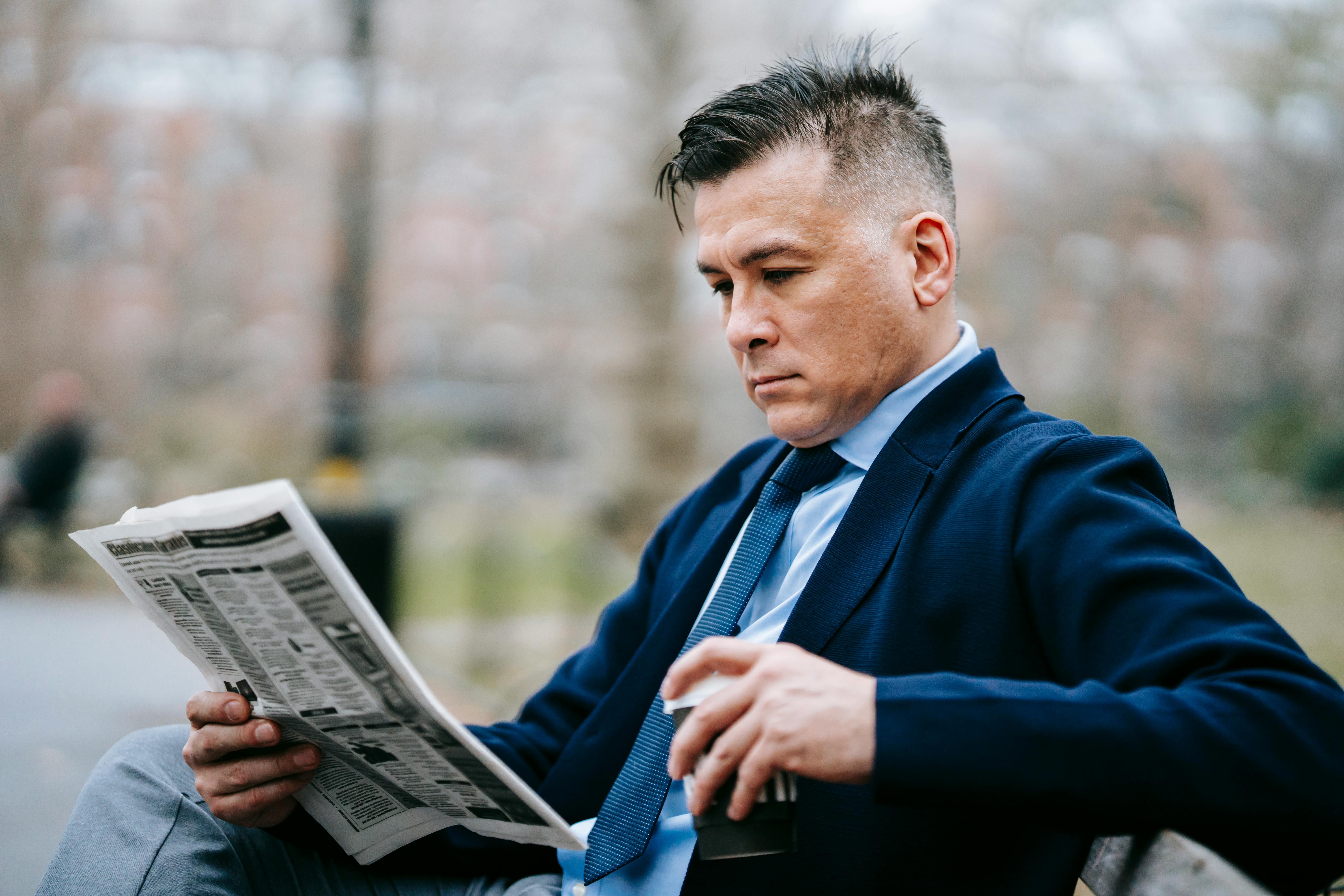 Photo Of Man Reading Newspaper · Free Stock Photo