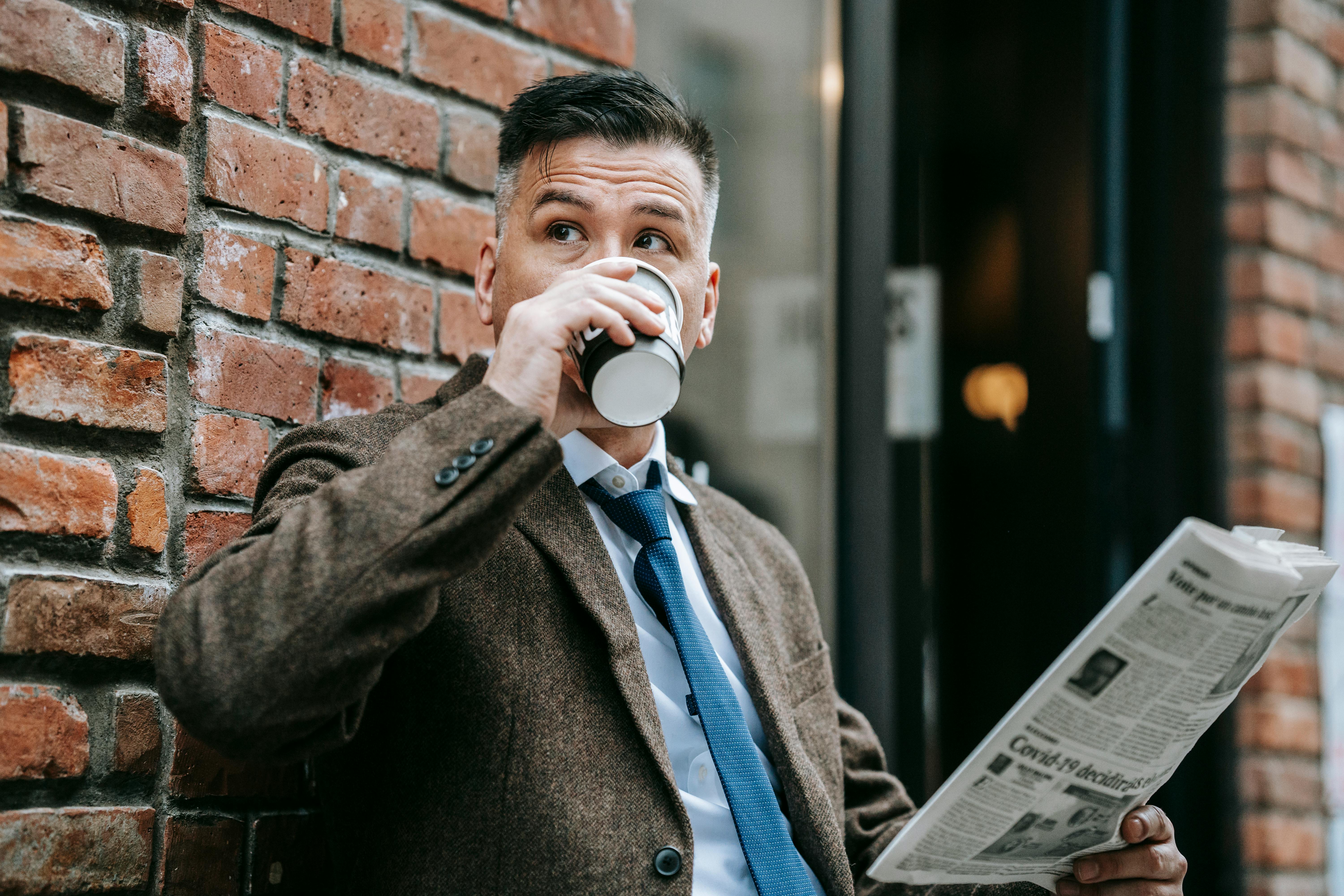 Photo Of Man Holding Newspaper · Free Stock Photo