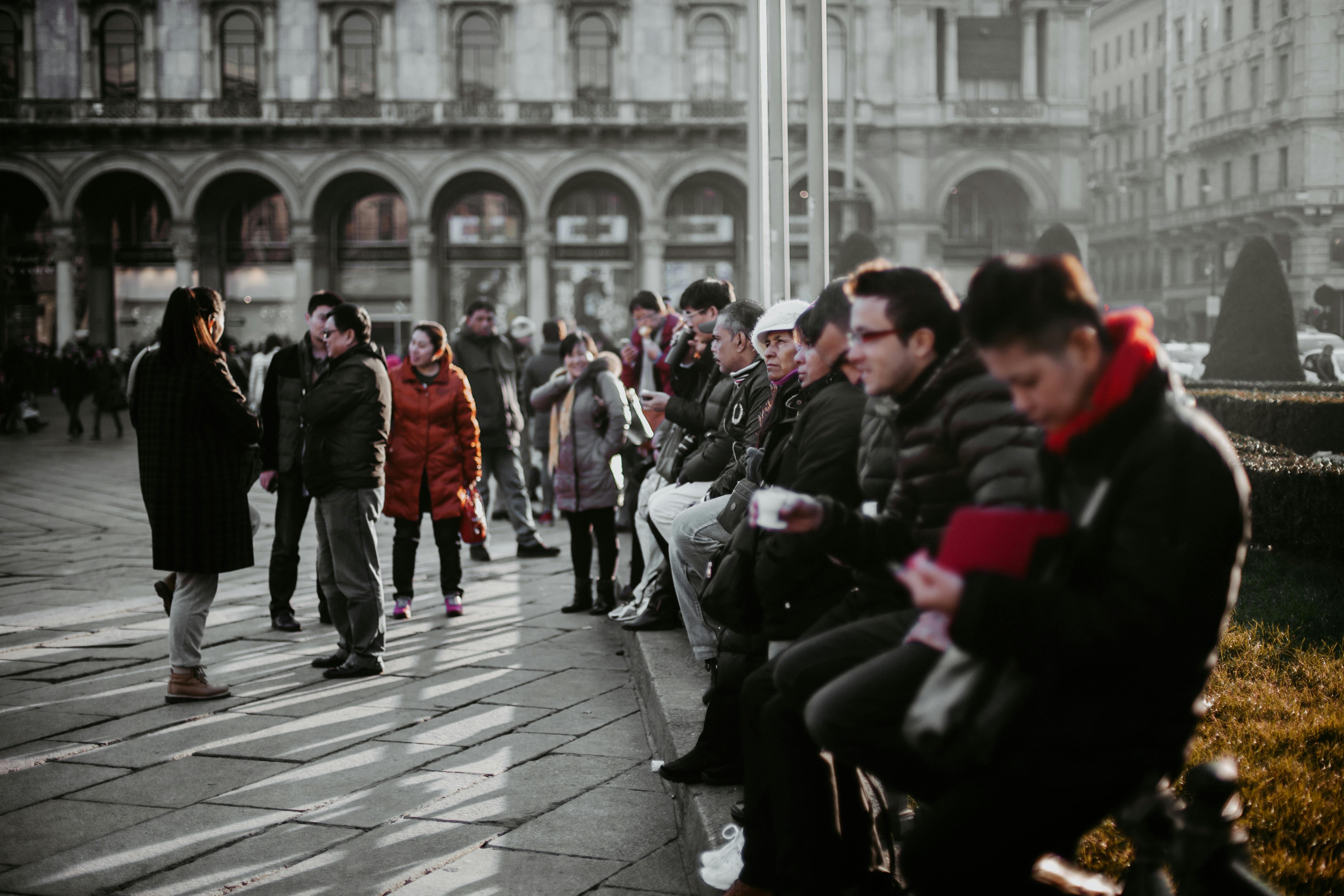 People Gathering in the Street in Front of the Illuminated Building ...