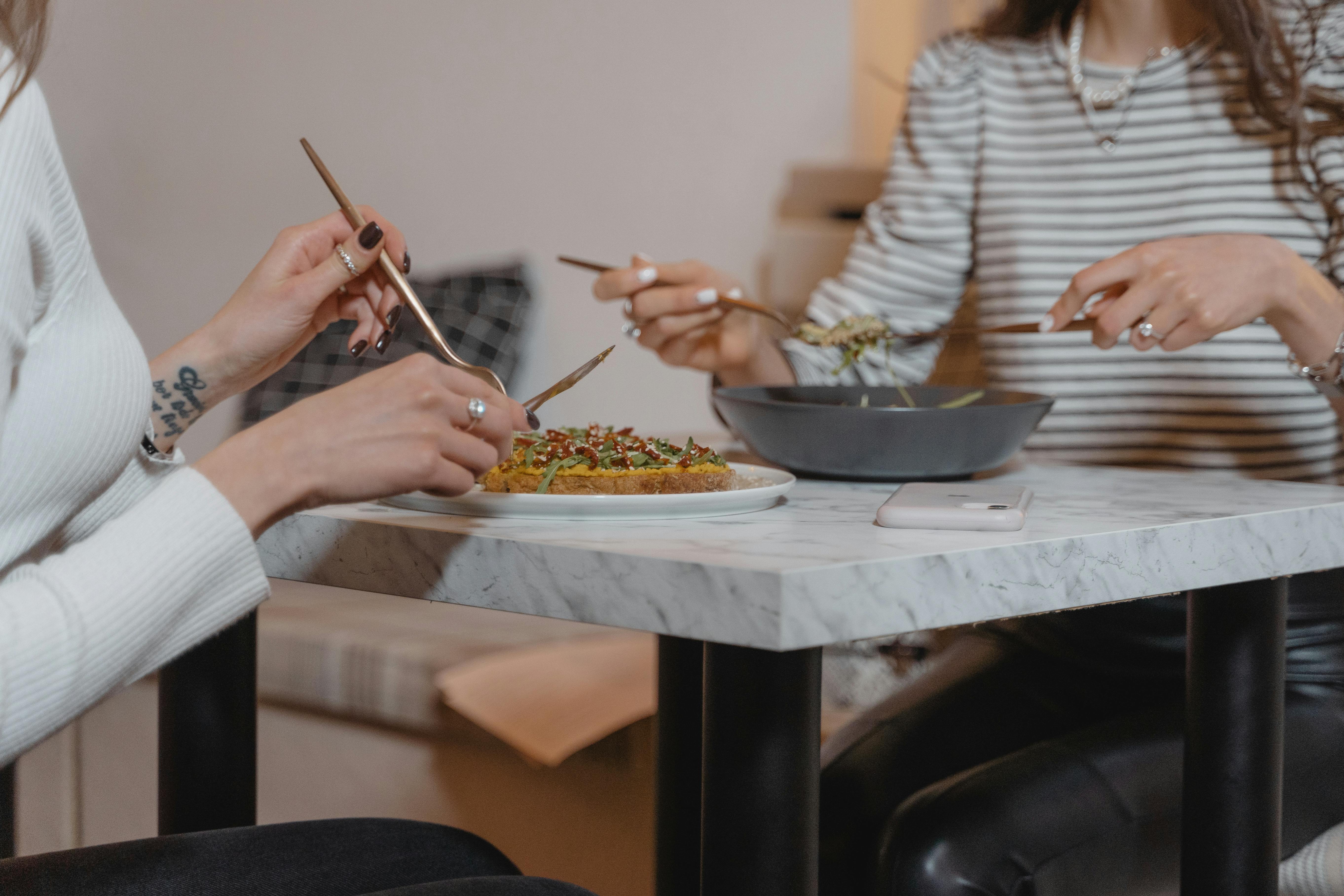 Group of Friends Having a Conversation while Eating Together · Free ...
