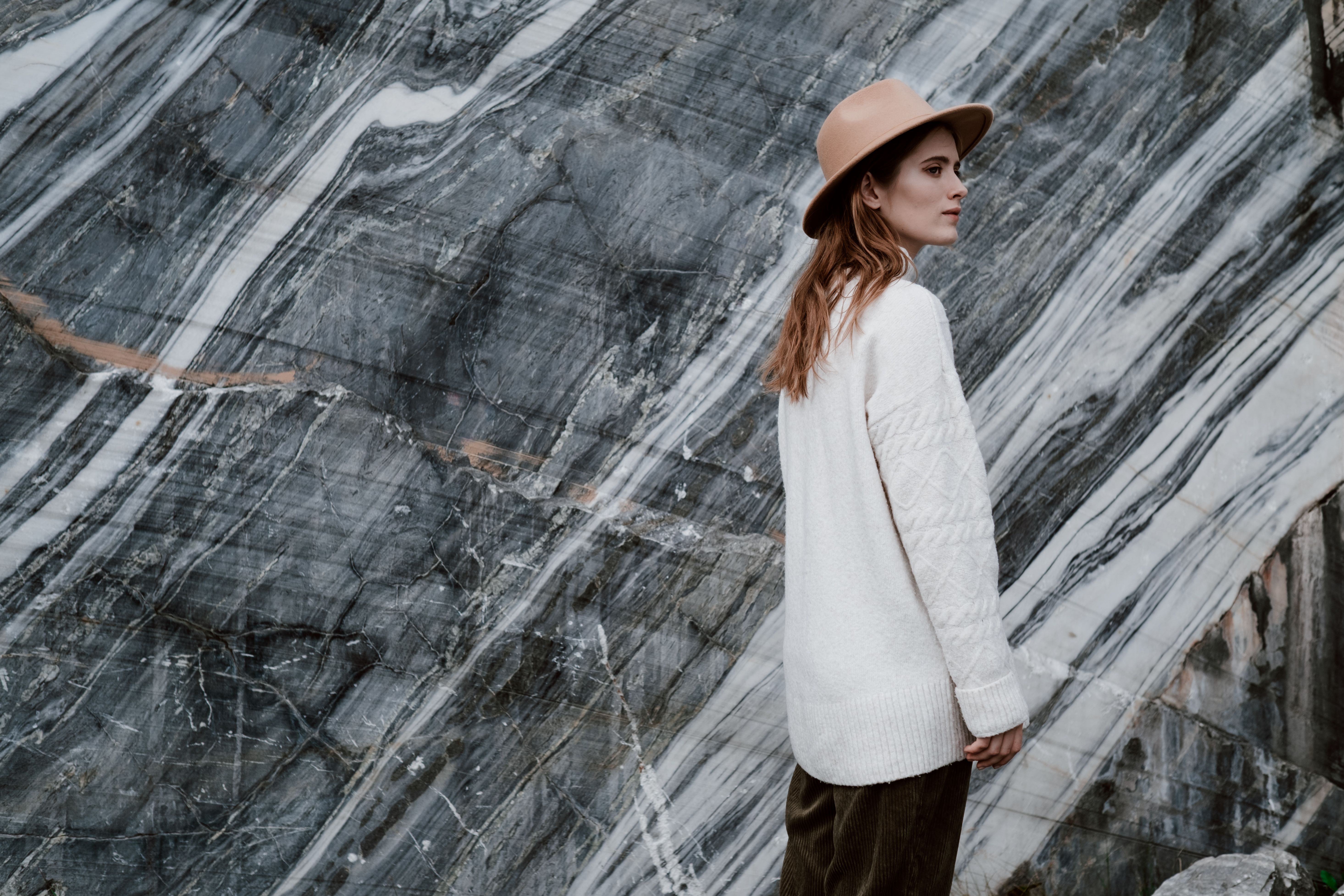 Woman Standing Beside the Rock Formation · Free Stock Photo