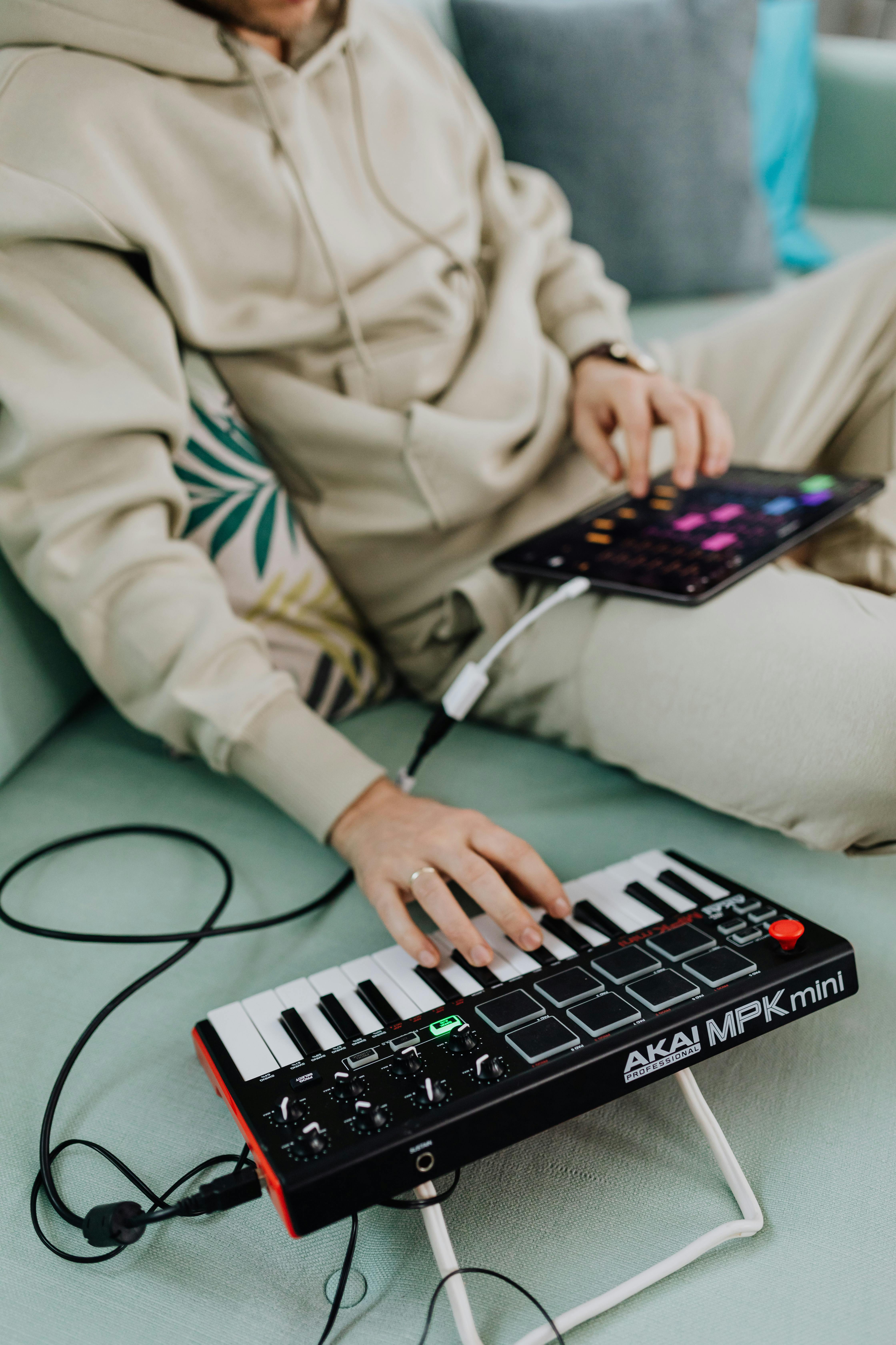 A Person Playing Music Using Electronic Devices · Free Stock Photo