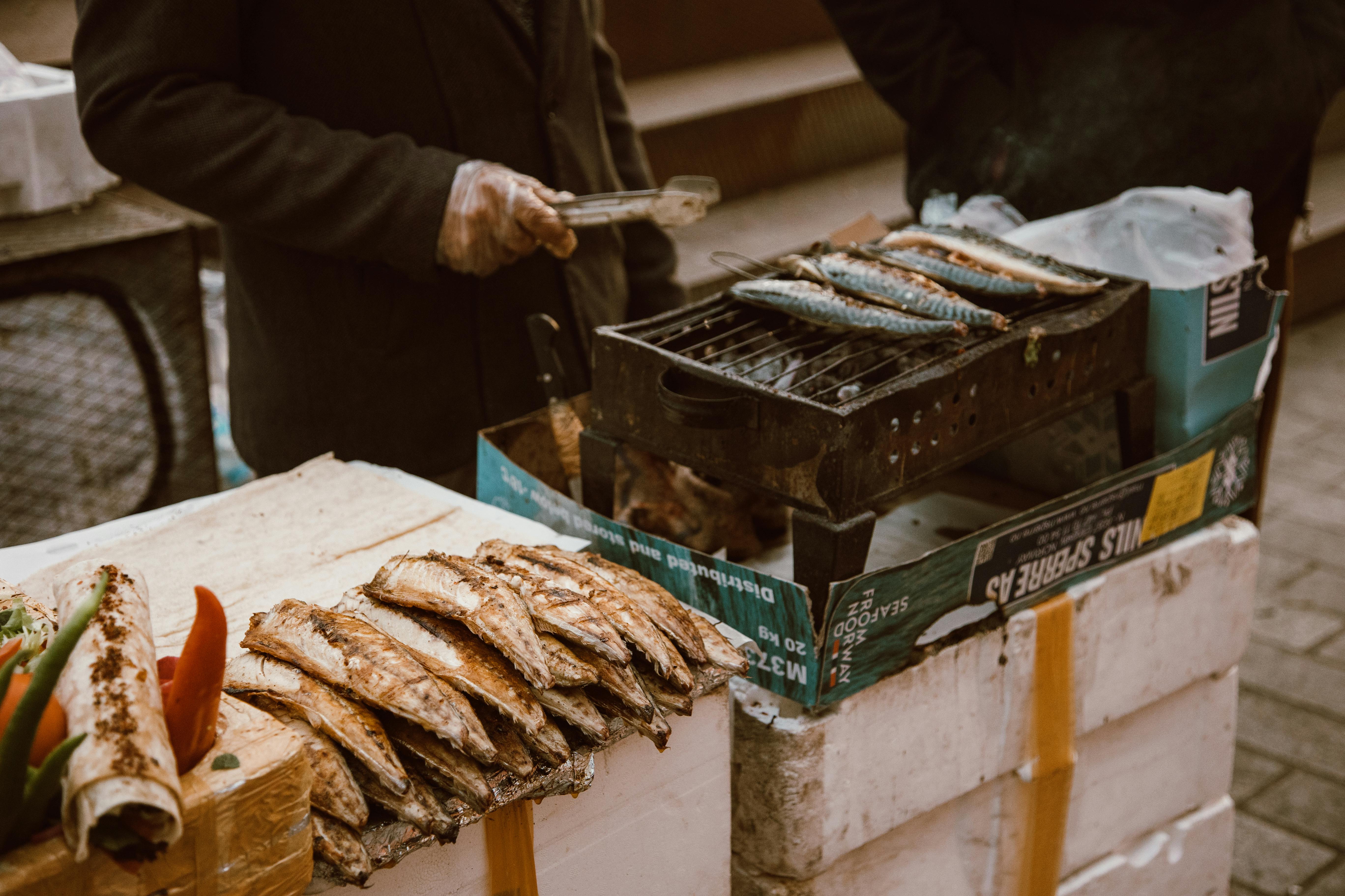 Person Grilling Fish · Free Stock Photo