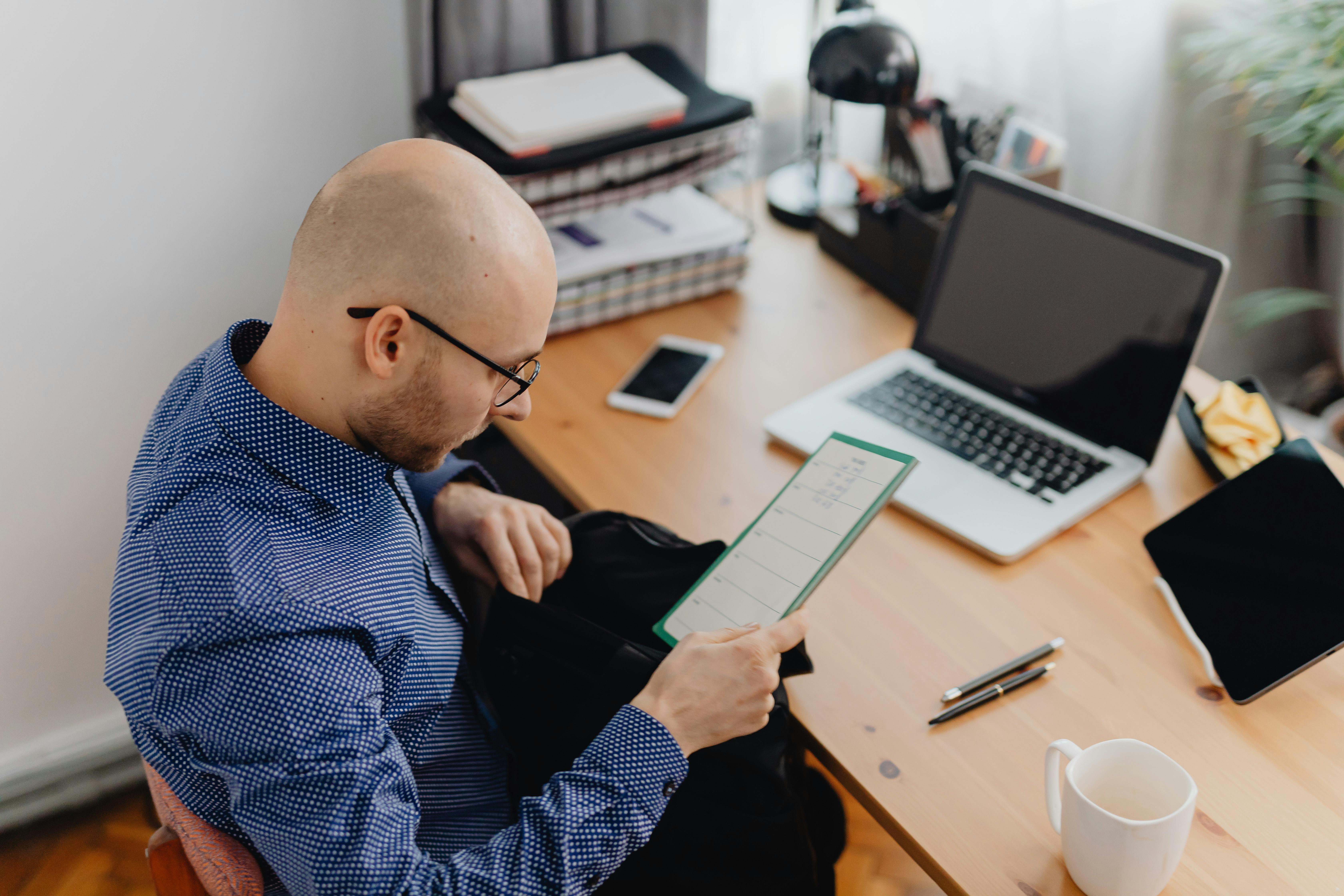 Man Sitting in Front of His Laptop · Free Stock Photo