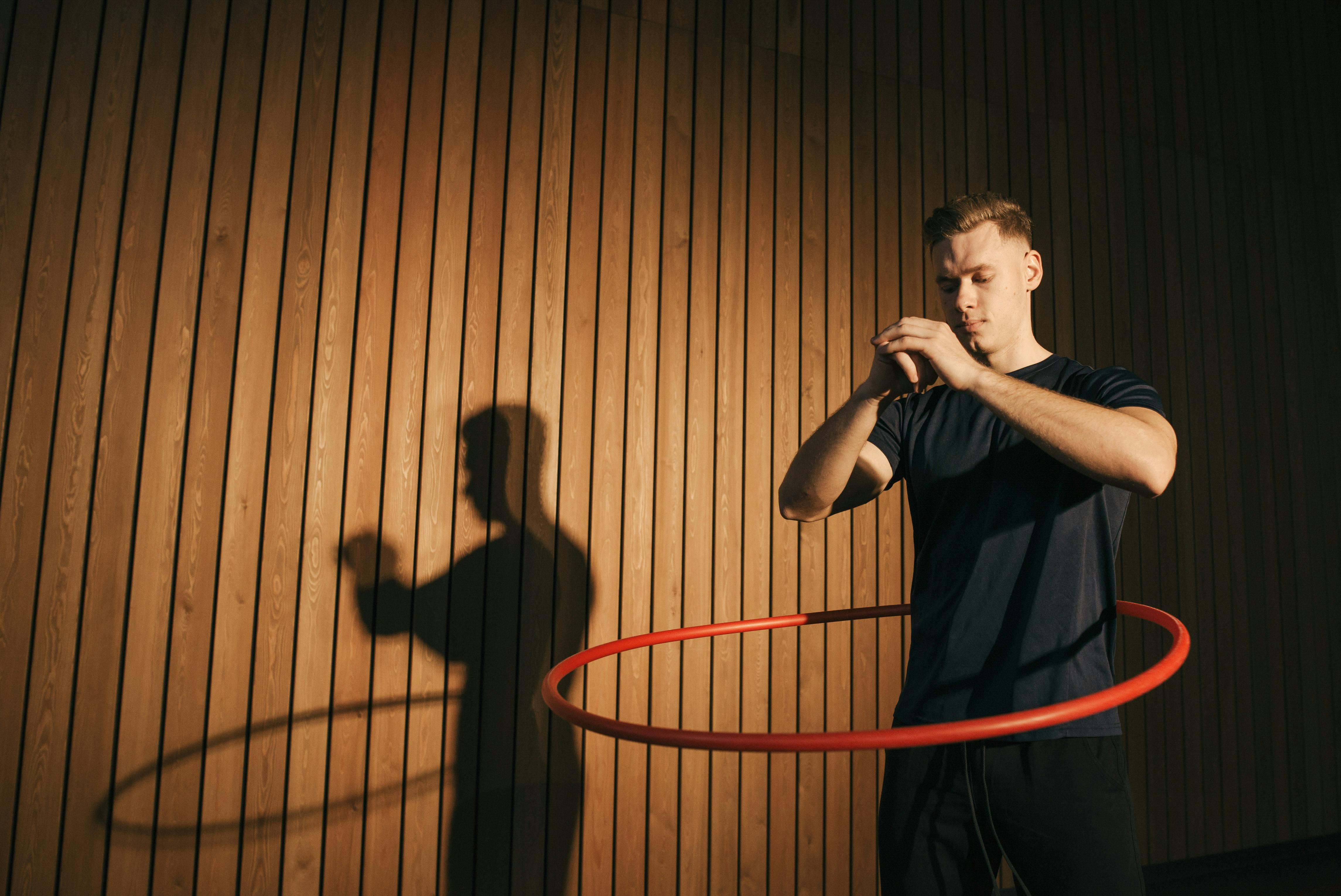Man Practicing with Hula Hoop · Free Stock Photo