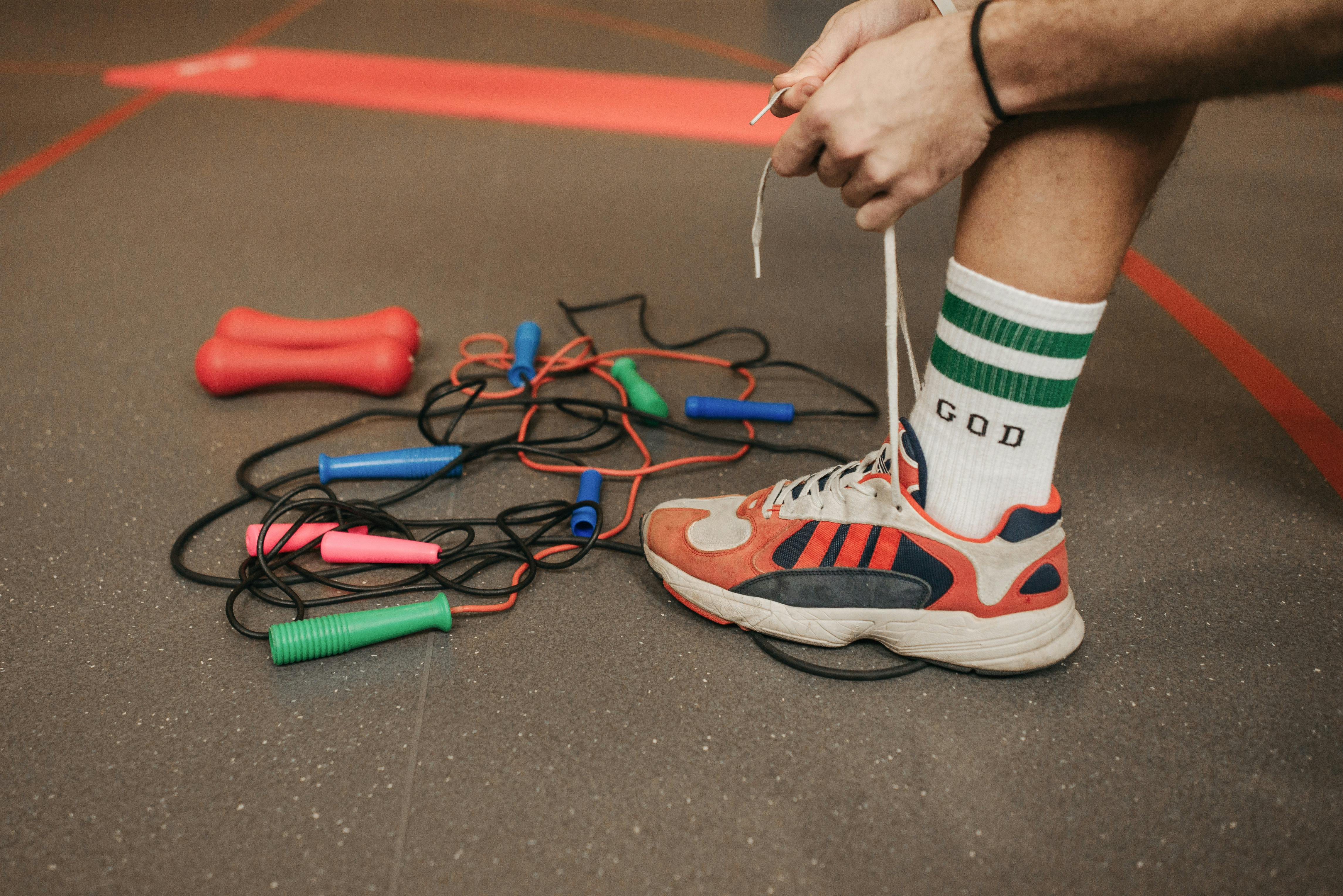 Close-Up Shot of a Person Lacing His Sneaker · Free Stock Photo