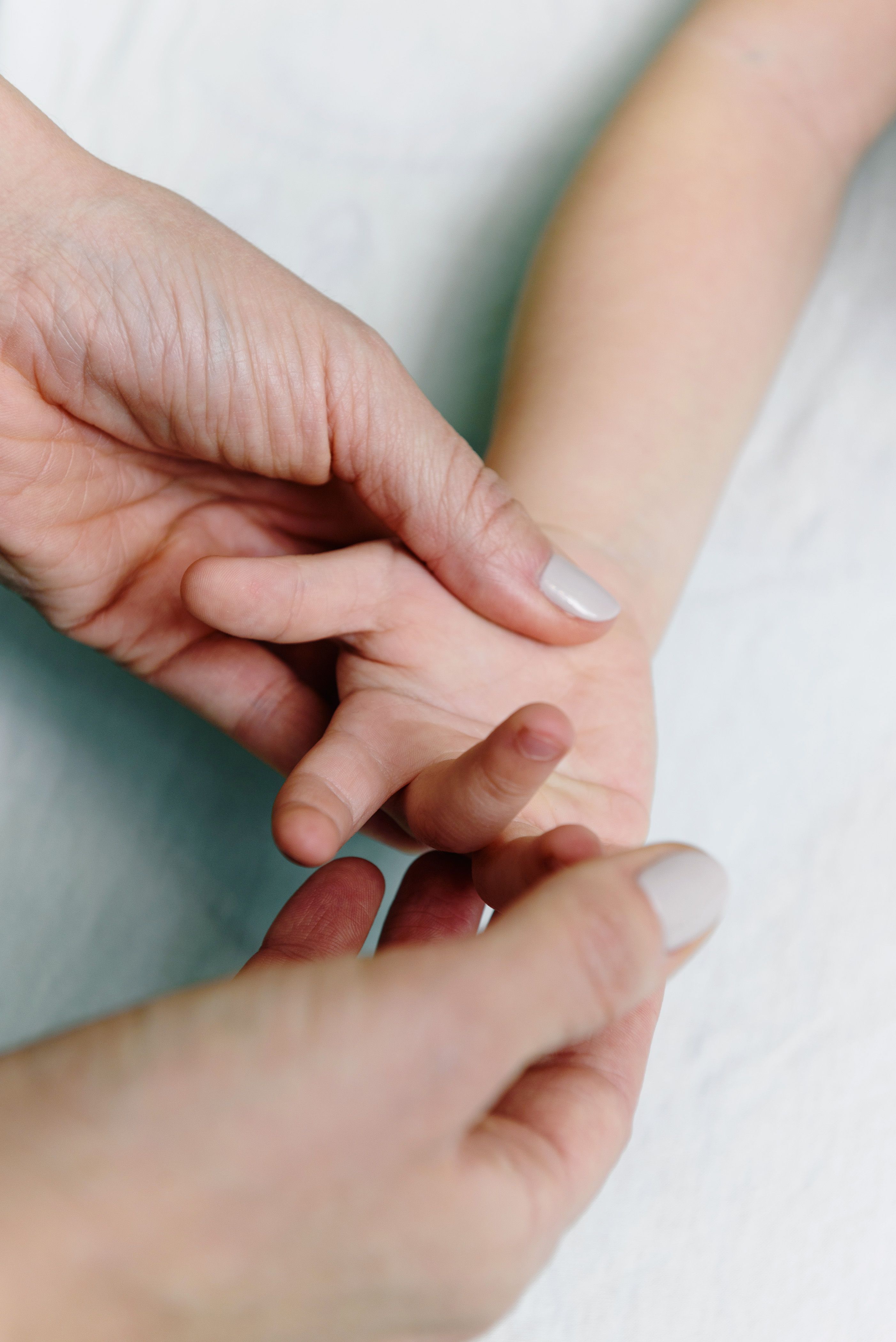 People Holding Hands in Close-up View · Free Stock Photo
