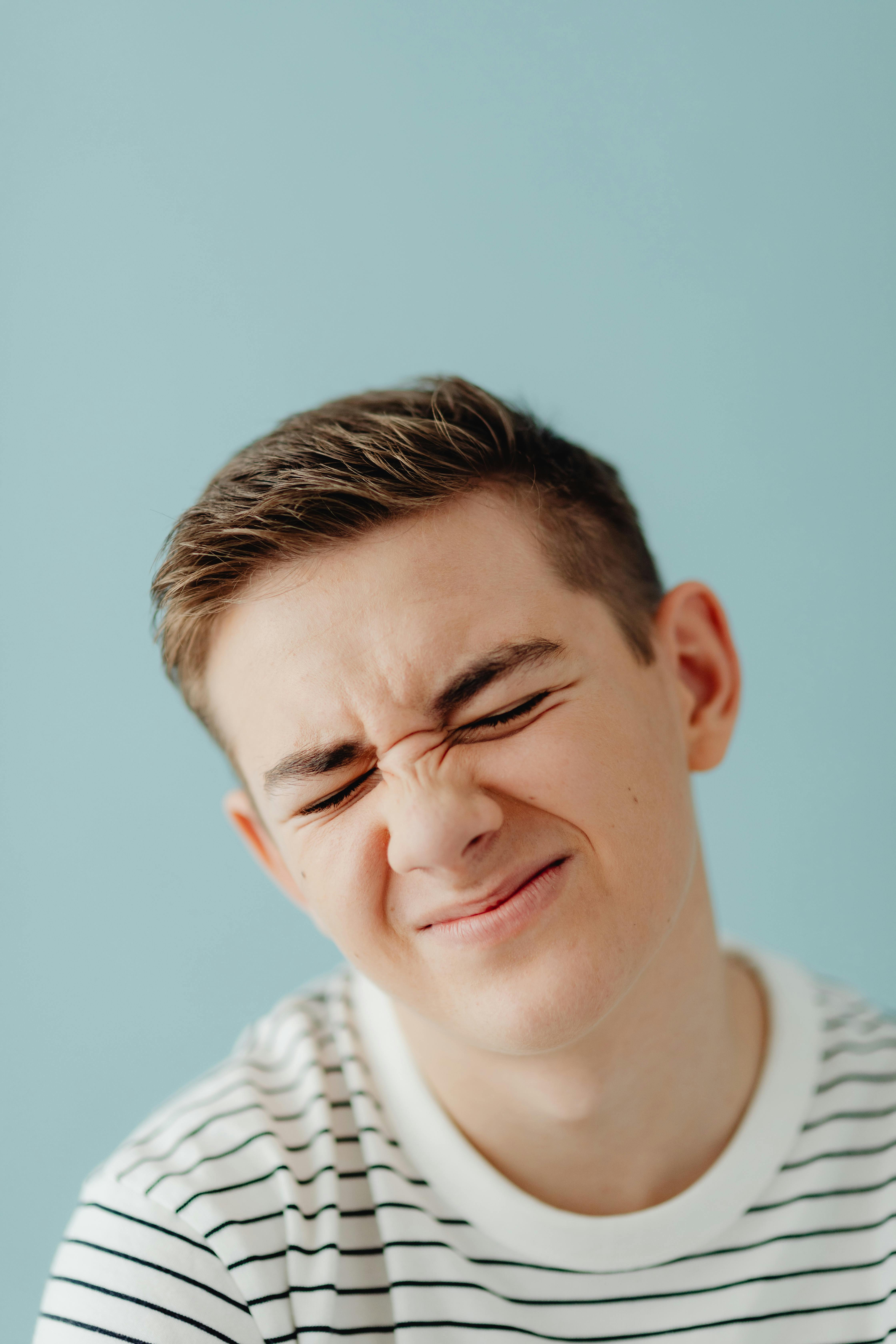 A Man with a Squinting Facial Expression · Free Stock Photo