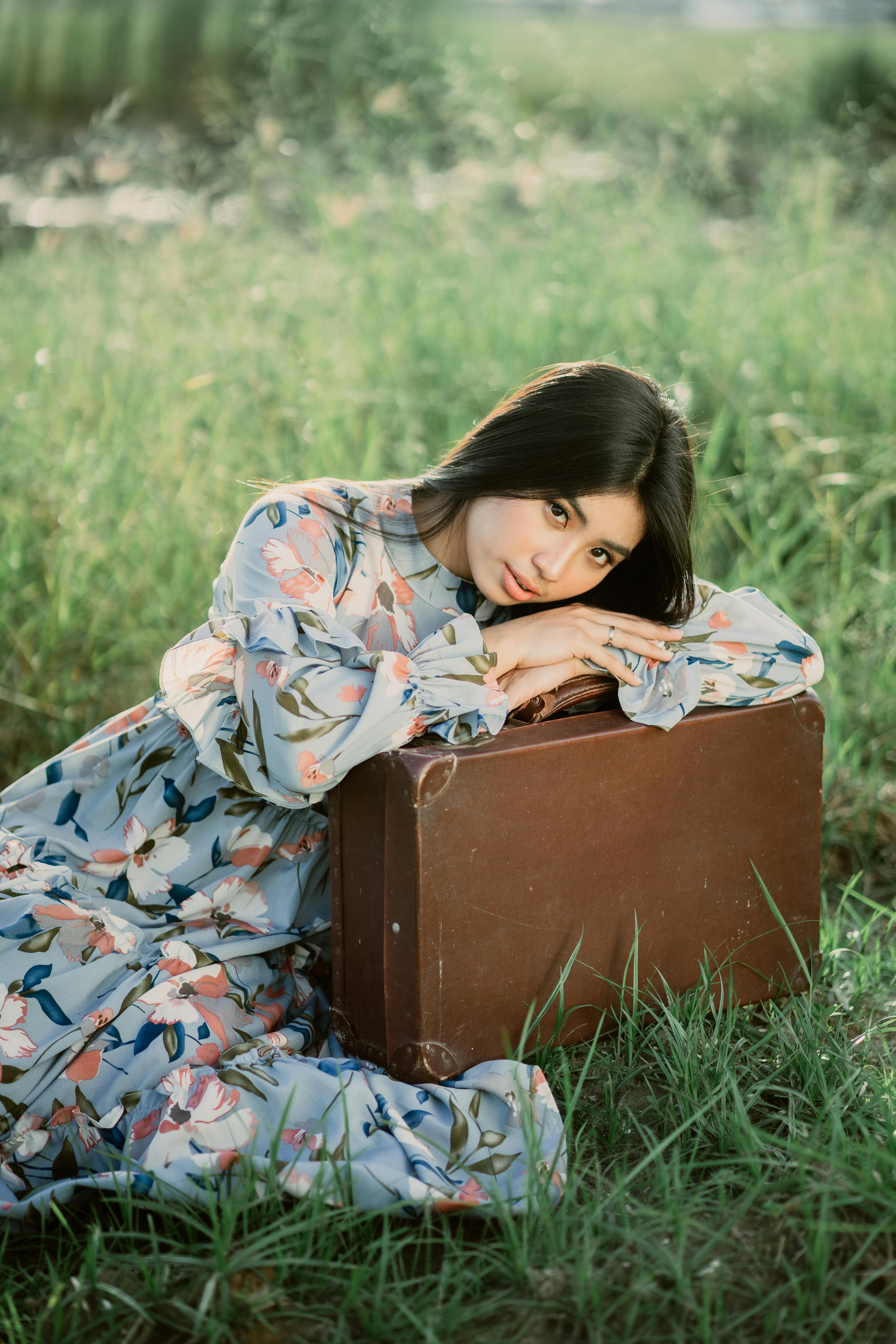 A Woman Posing With a Briefcase · Free Stock Photo