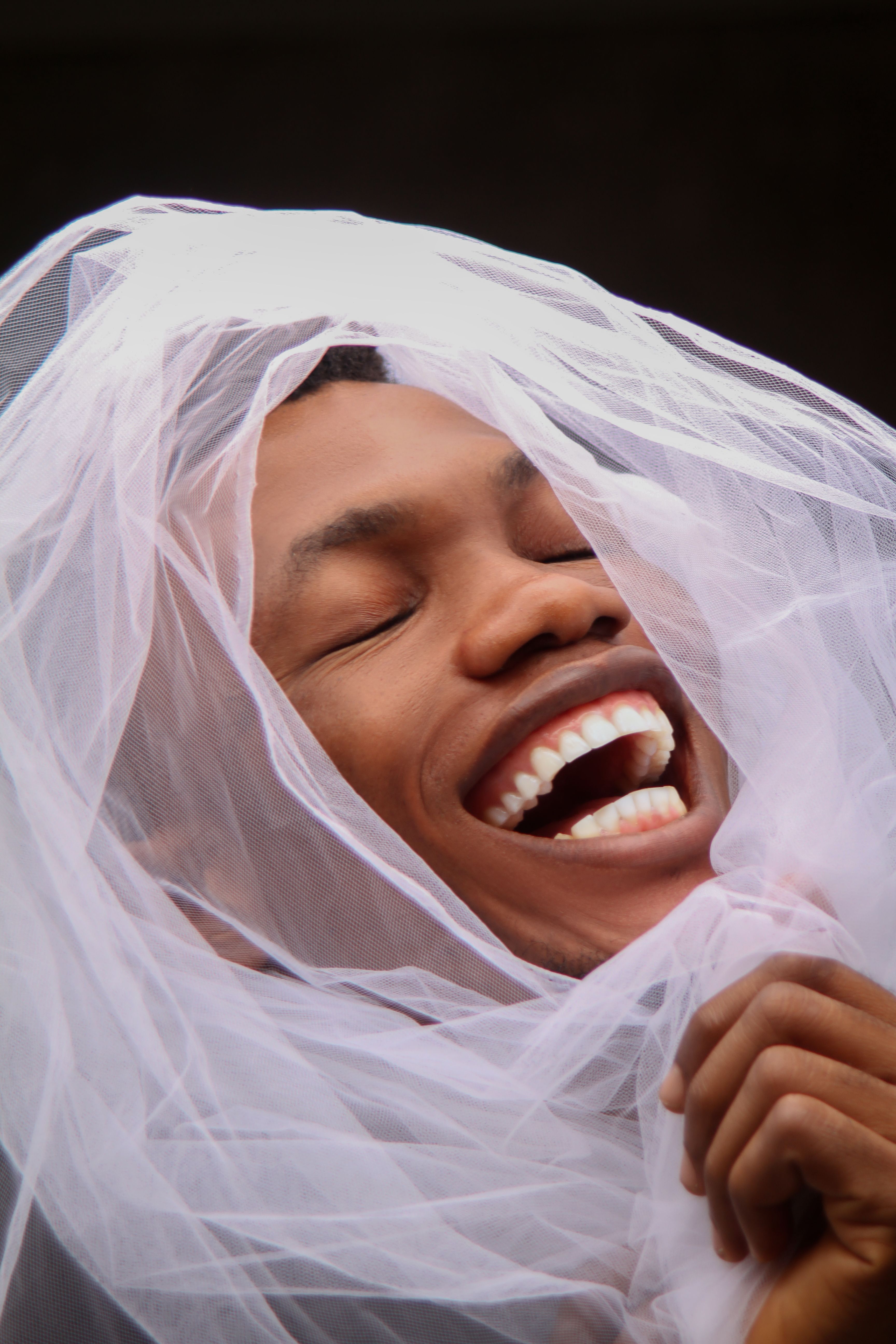 Close-Up Shot of a Man Laughing · Free Stock Photo