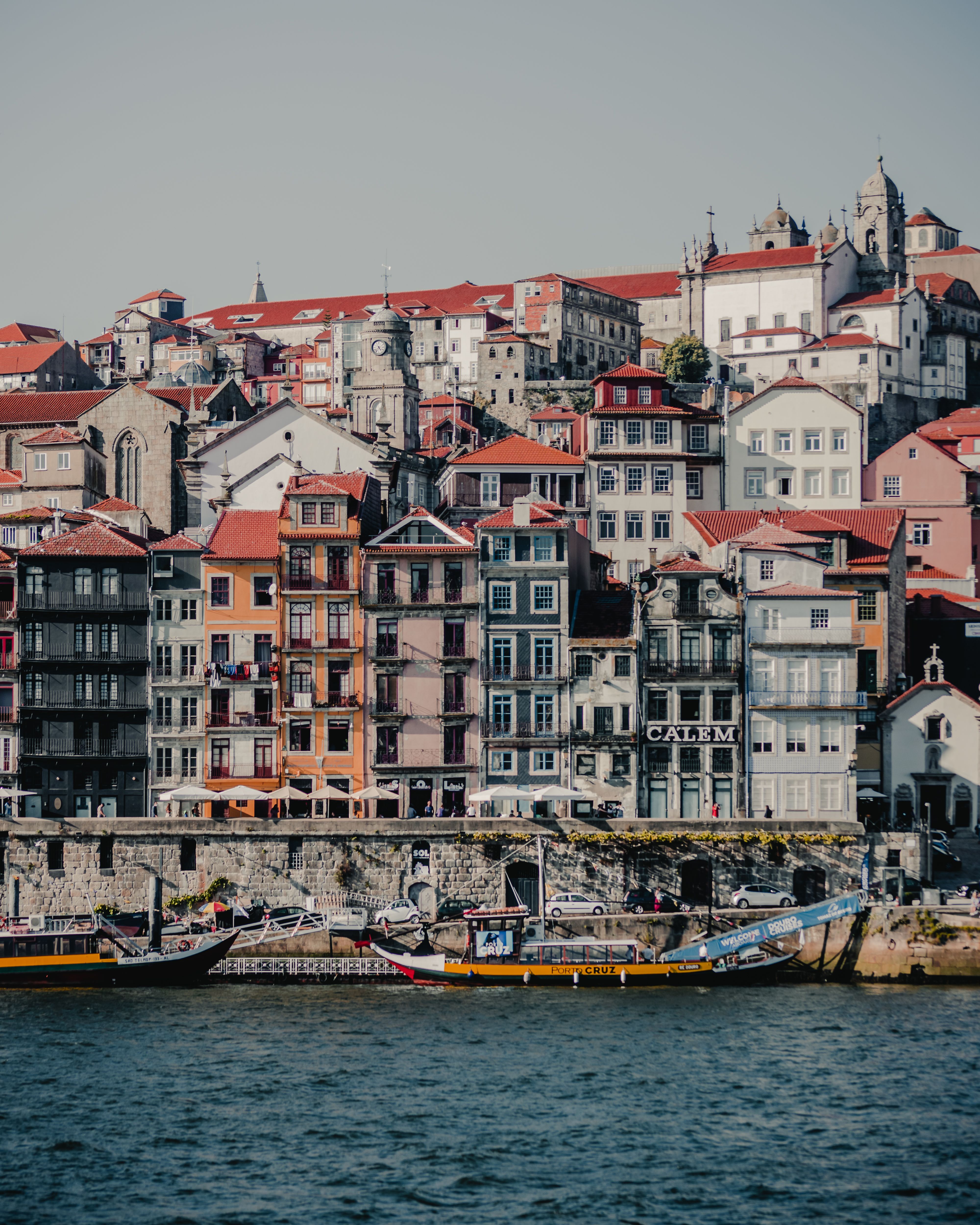 Concrete Buildings Near Body of Water · Free Stock Photo