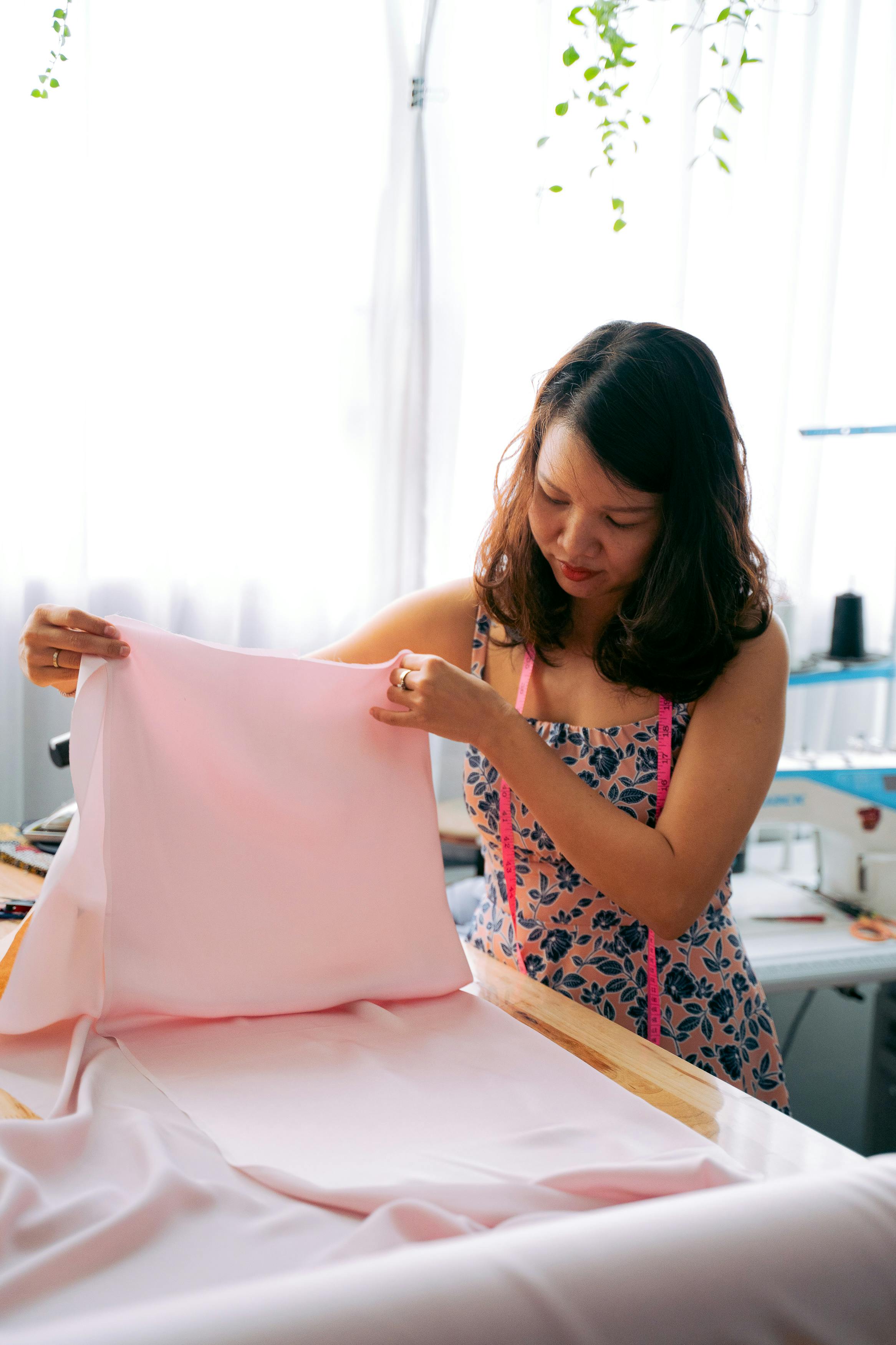Person Cutting Fabric with Scissors · Free Stock Photo
