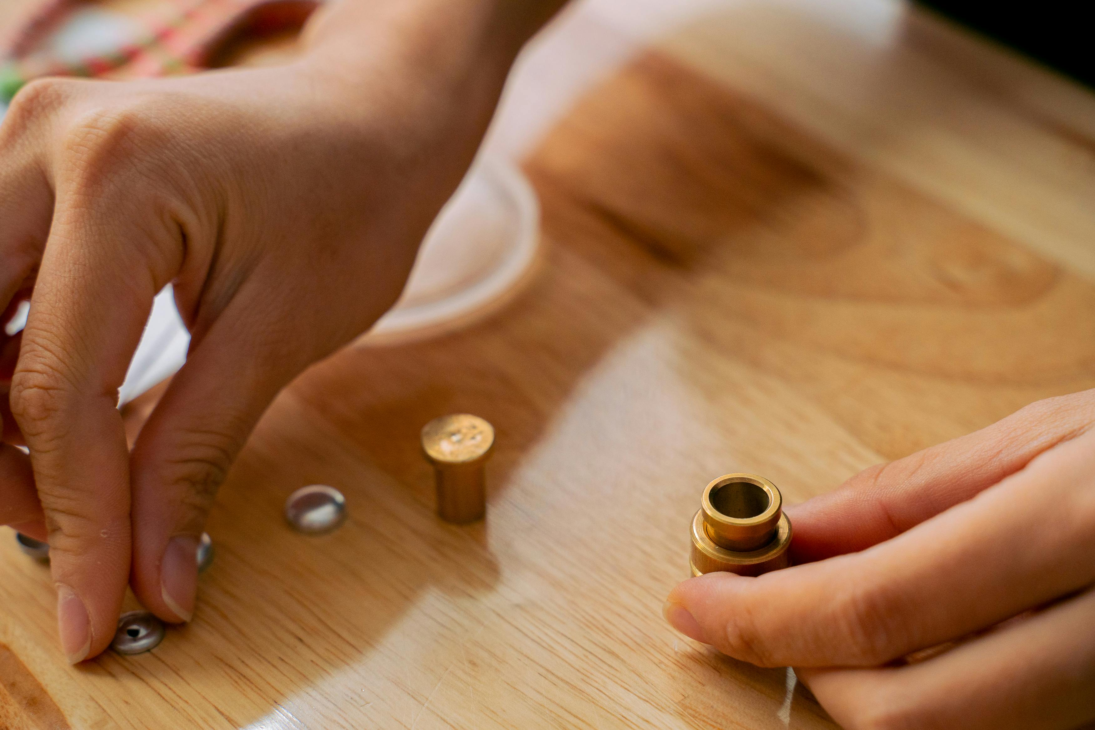 Seamstress Preparing Snap Fasteners · Free Stock Photo