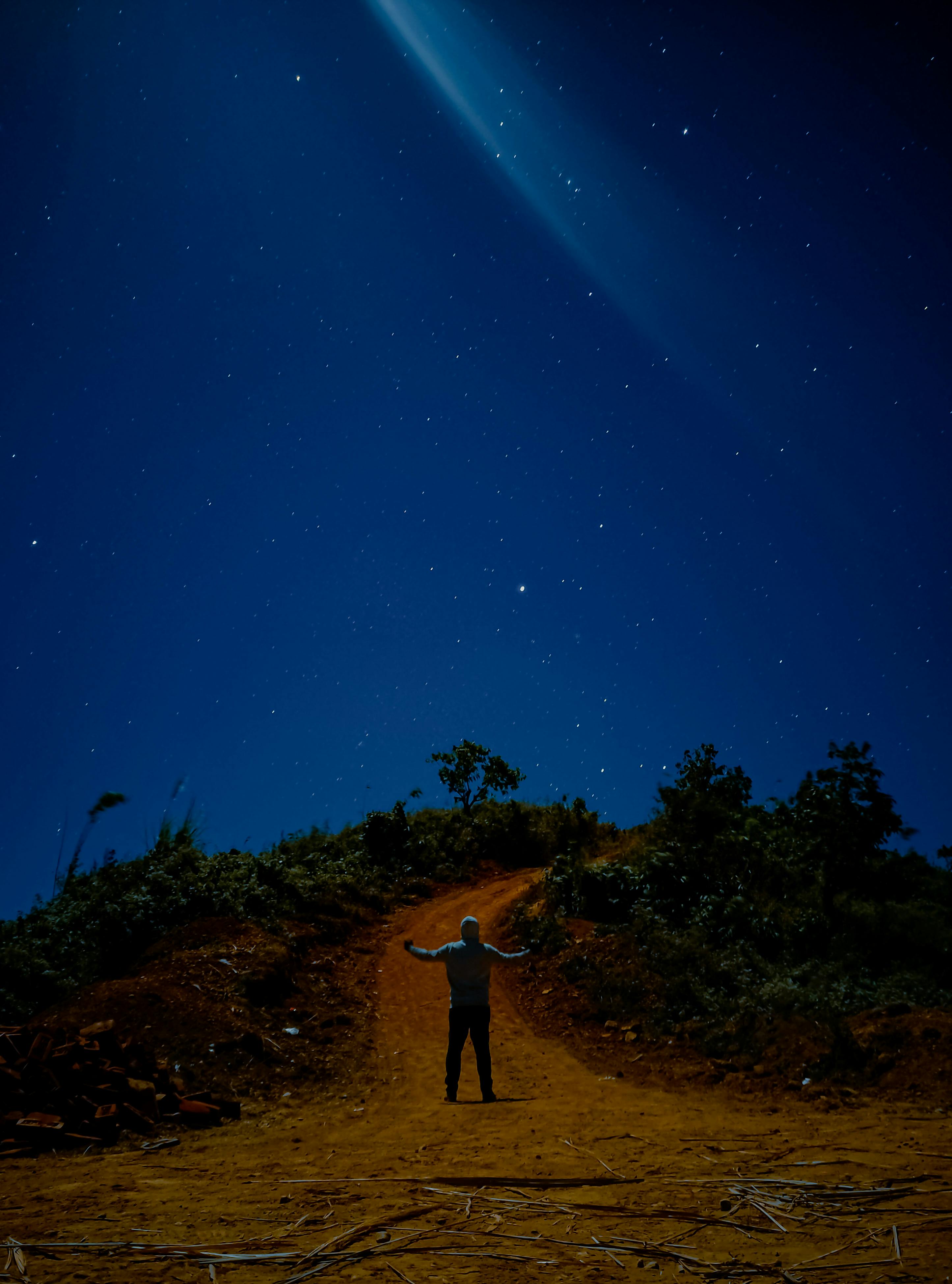 A Man Standing Under the Starry Sky · Free Stock Photo