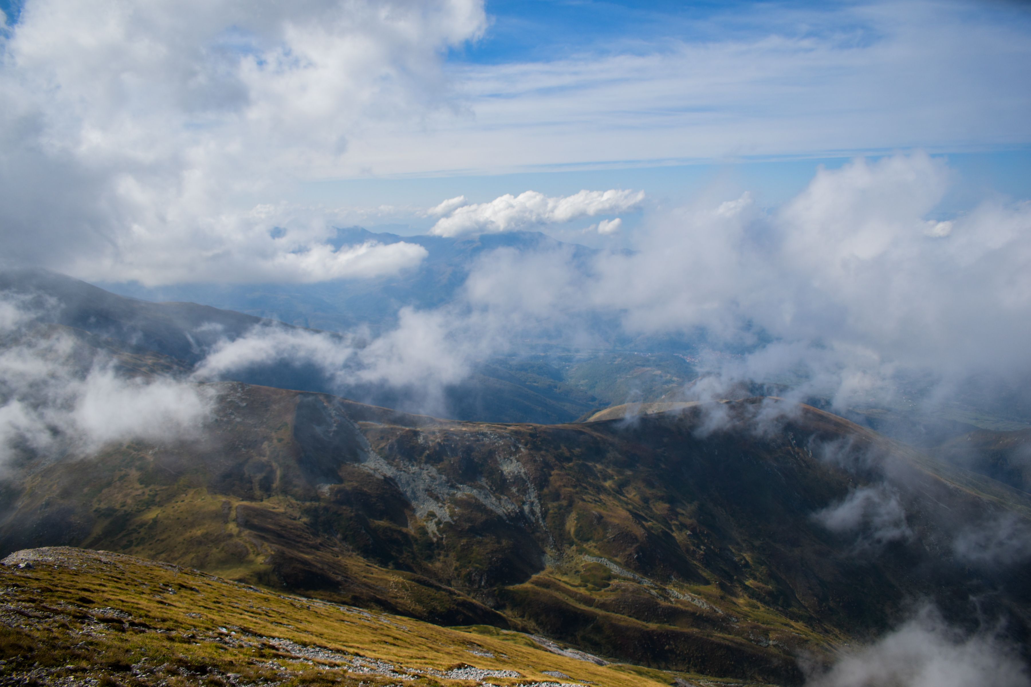 White Clouds Over Green Mountains · Free Stock Photo