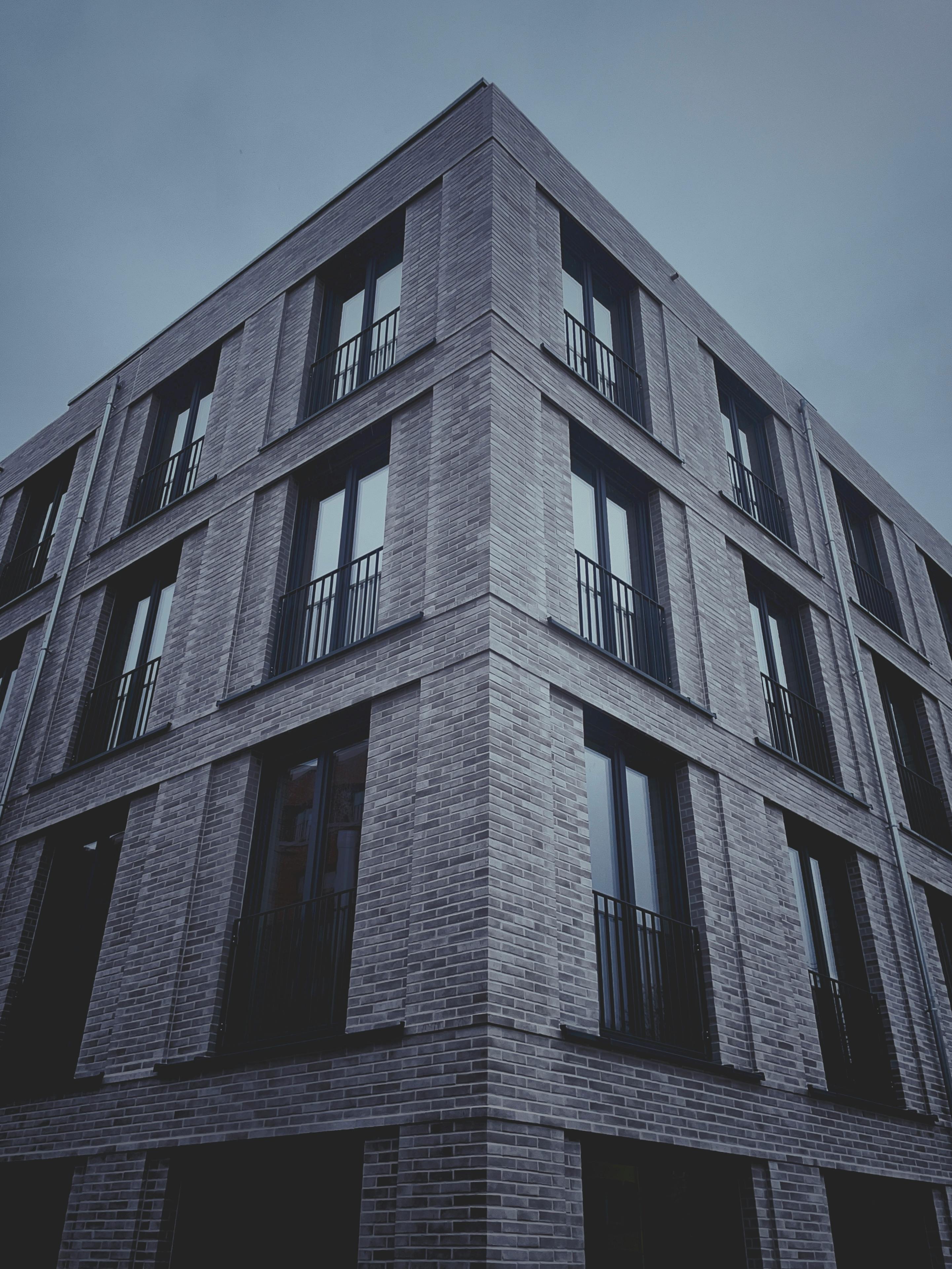Building with Brick Wall and Glass Windows · Free Stock Photo