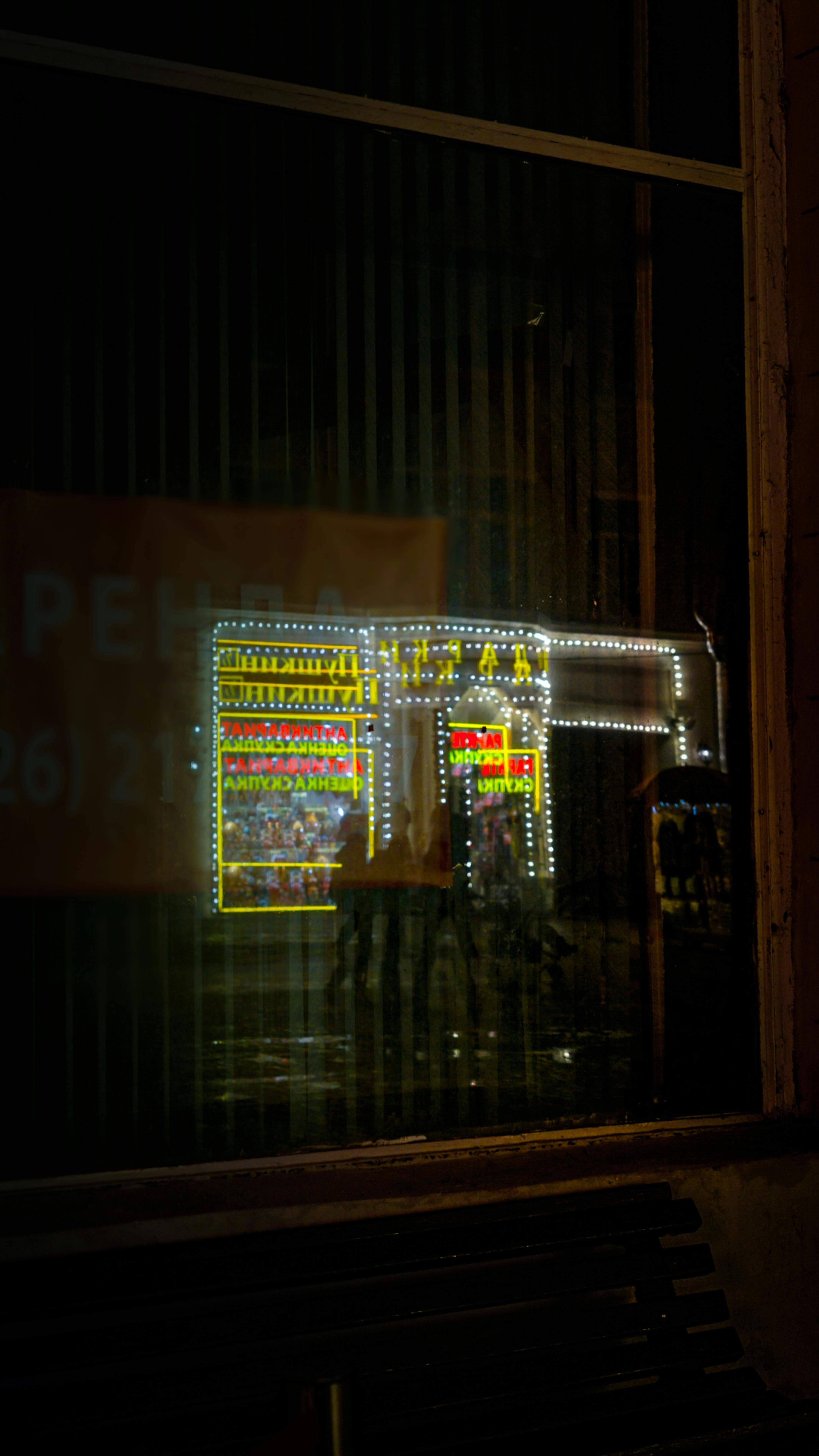 Reflection of a Light from the Storefront on the Glass Window · Free ...