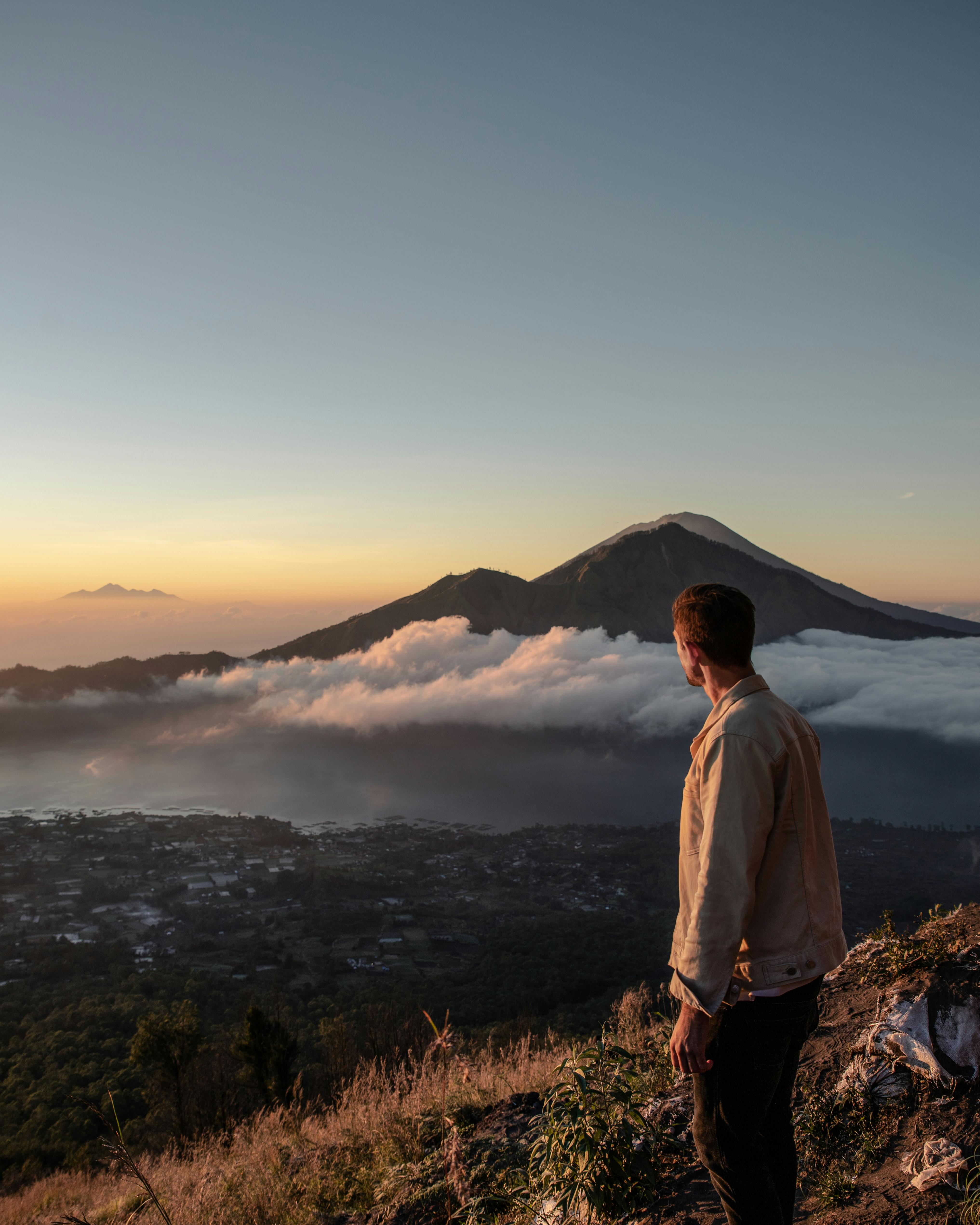 A Man Standing on the Mountain Summit · Free Stock Photo