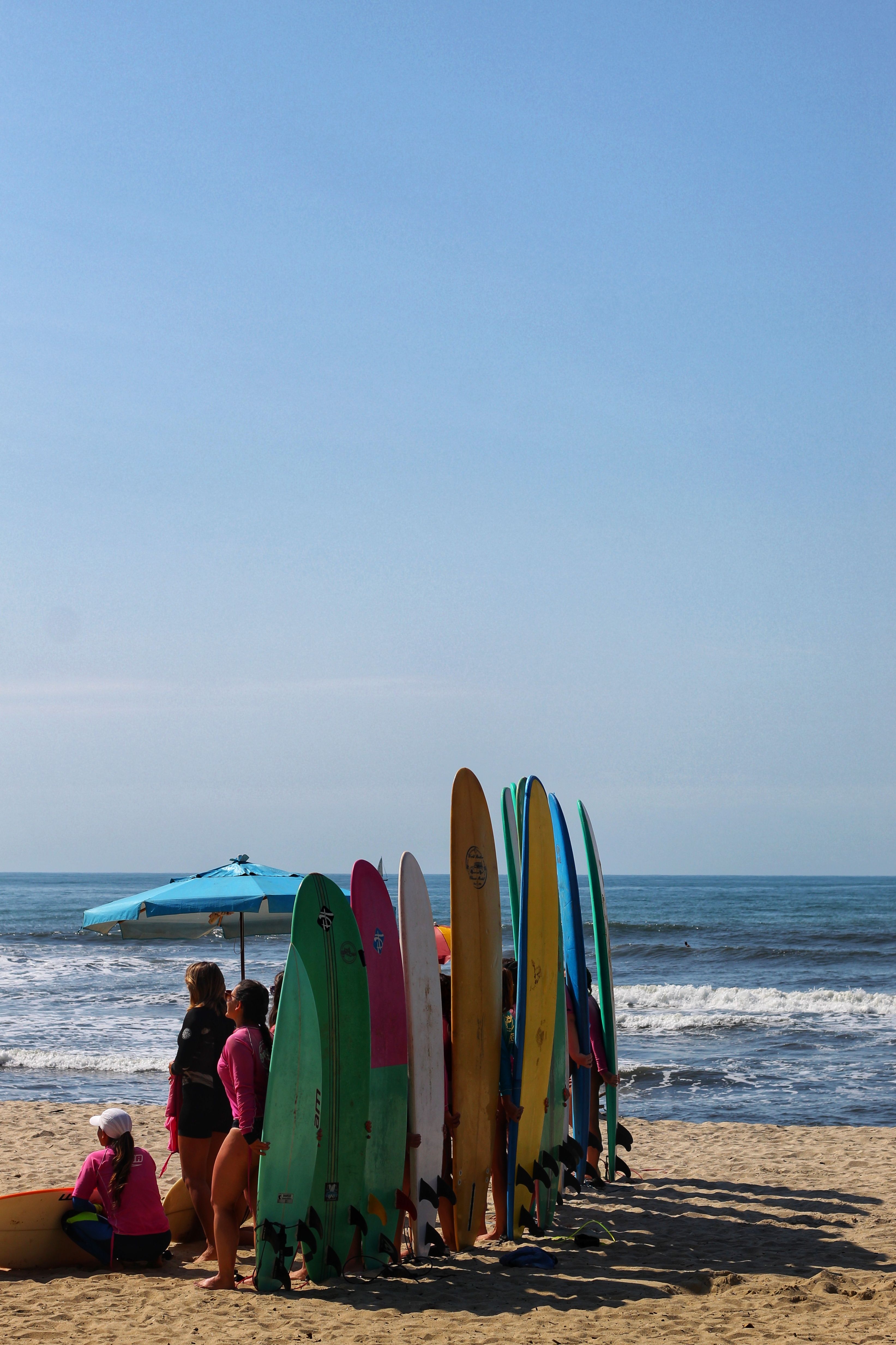 A Surfboard on a Brick Fence · Free Stock Photo