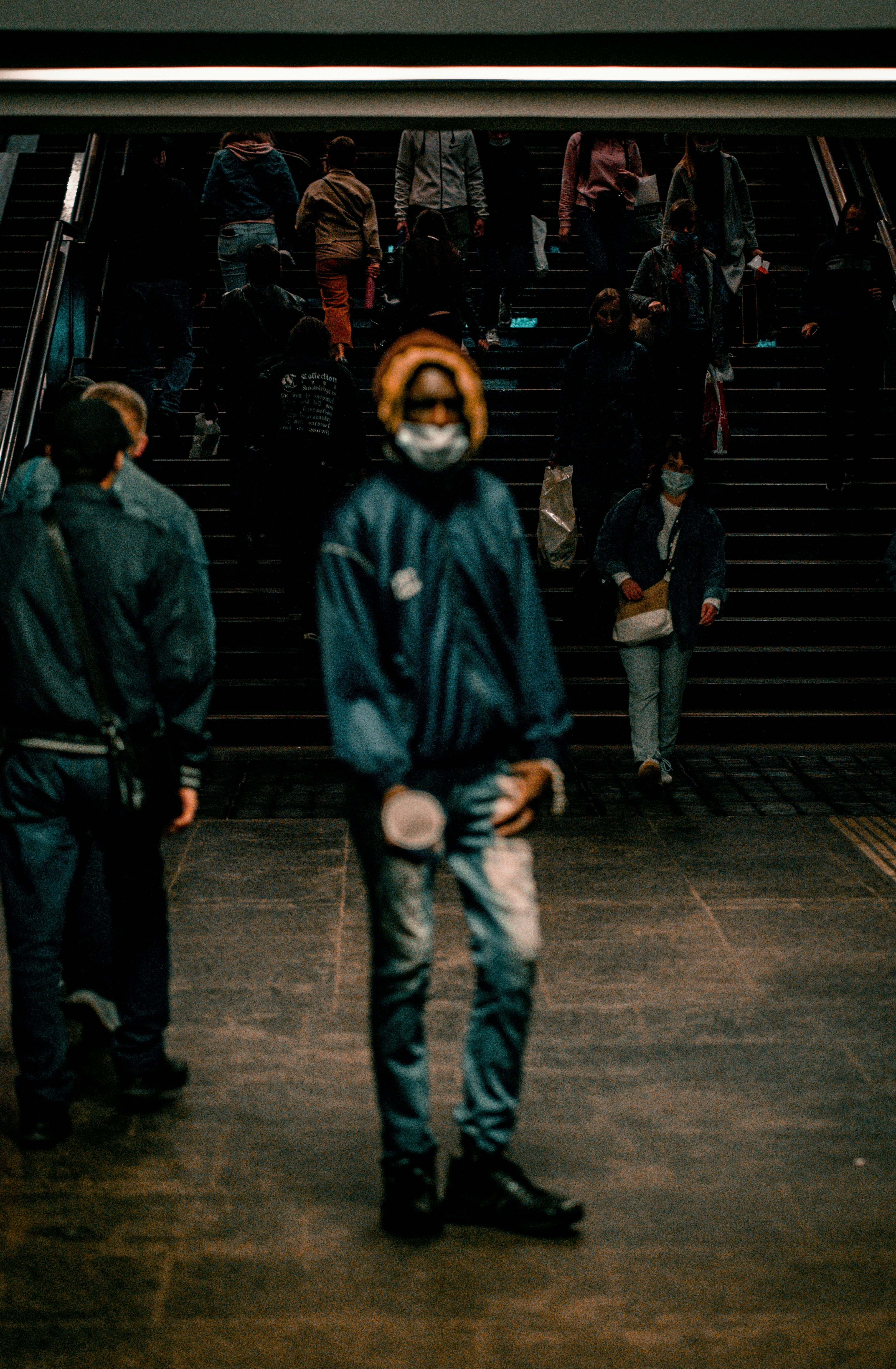 Pedestrian Walking Down Stairs of Underground Passage · Free Stock Photo