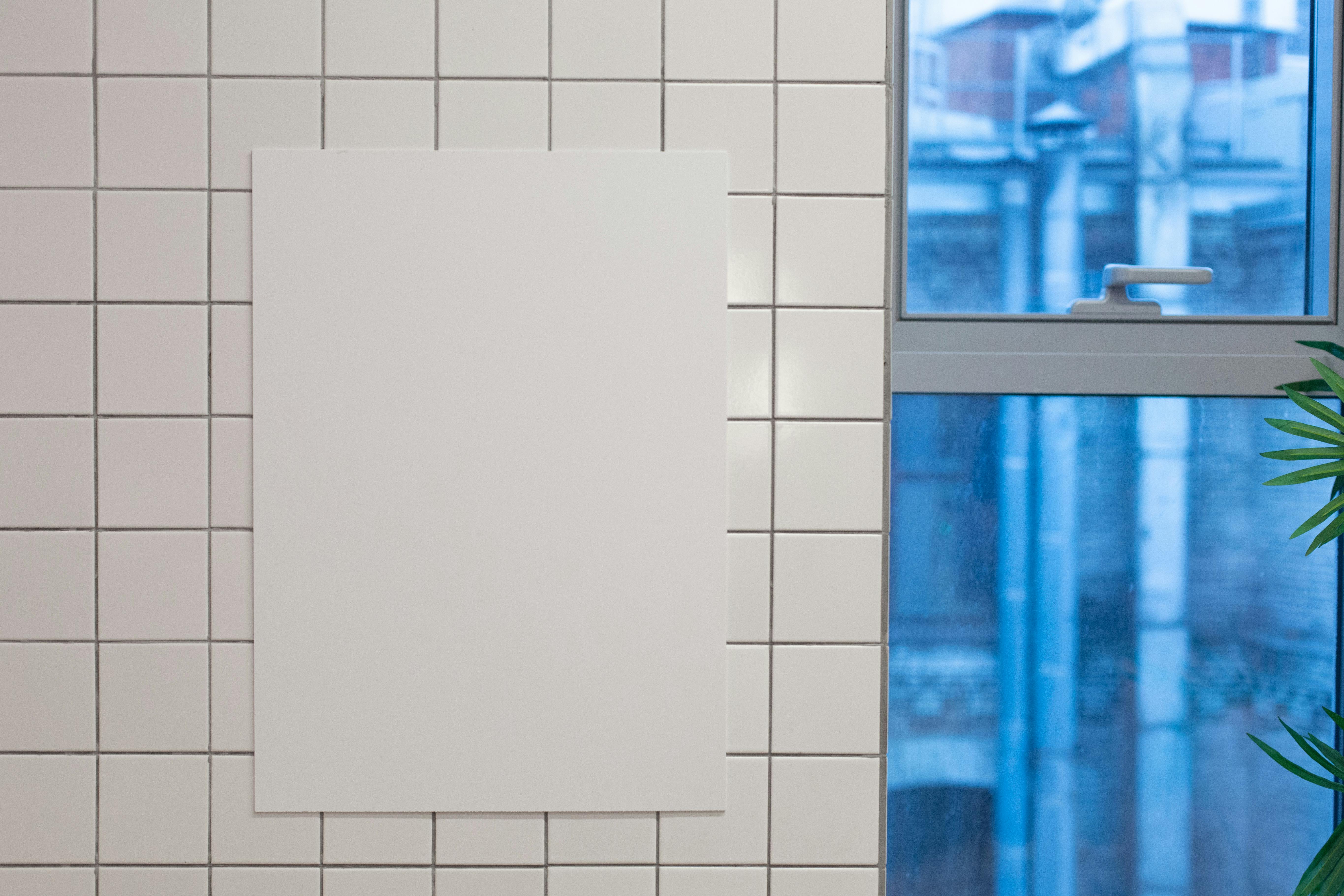 Blank poster hanging near window · Free Stock Photo