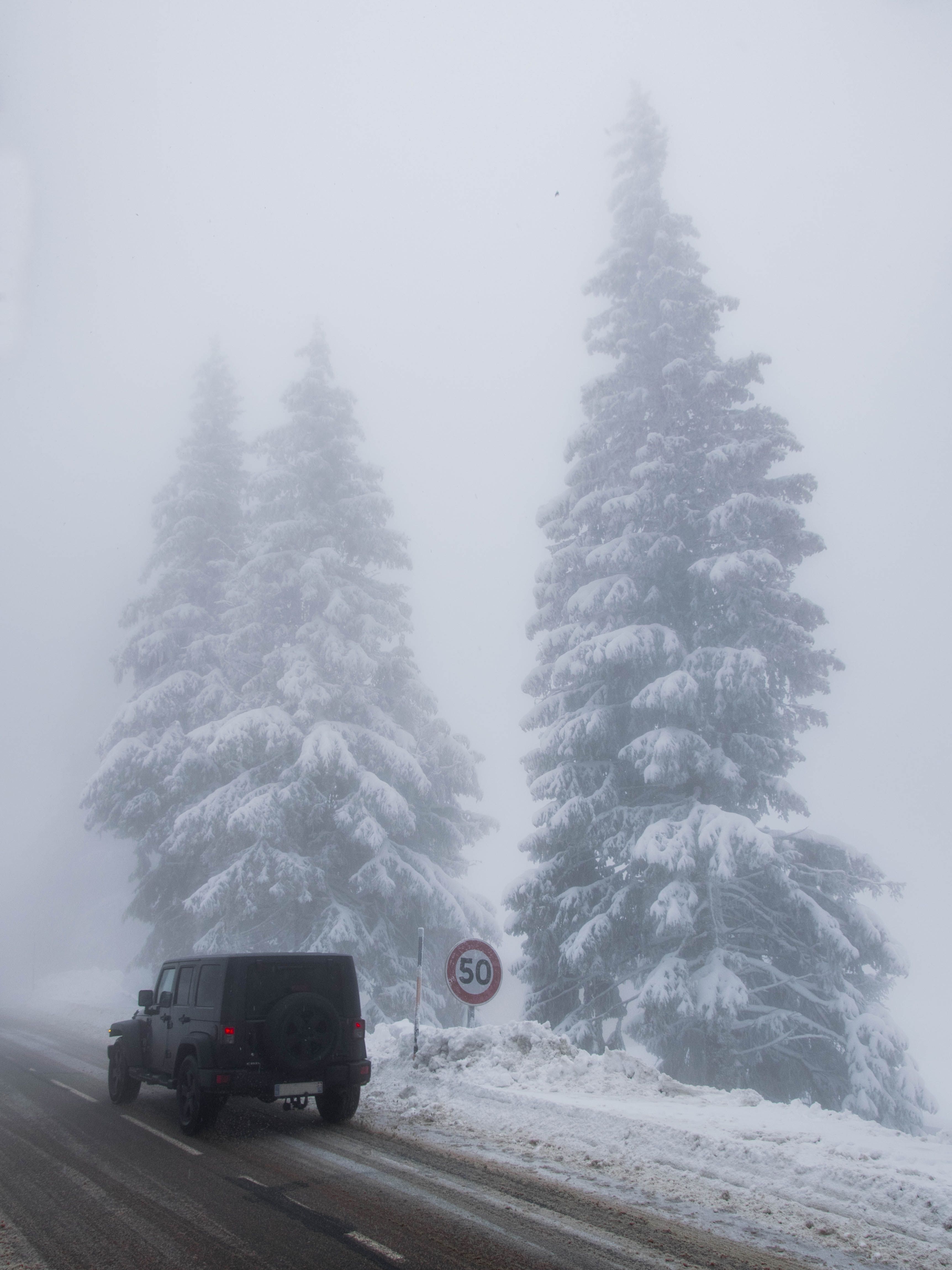 Car on Snowy Road · Free Stock Photo