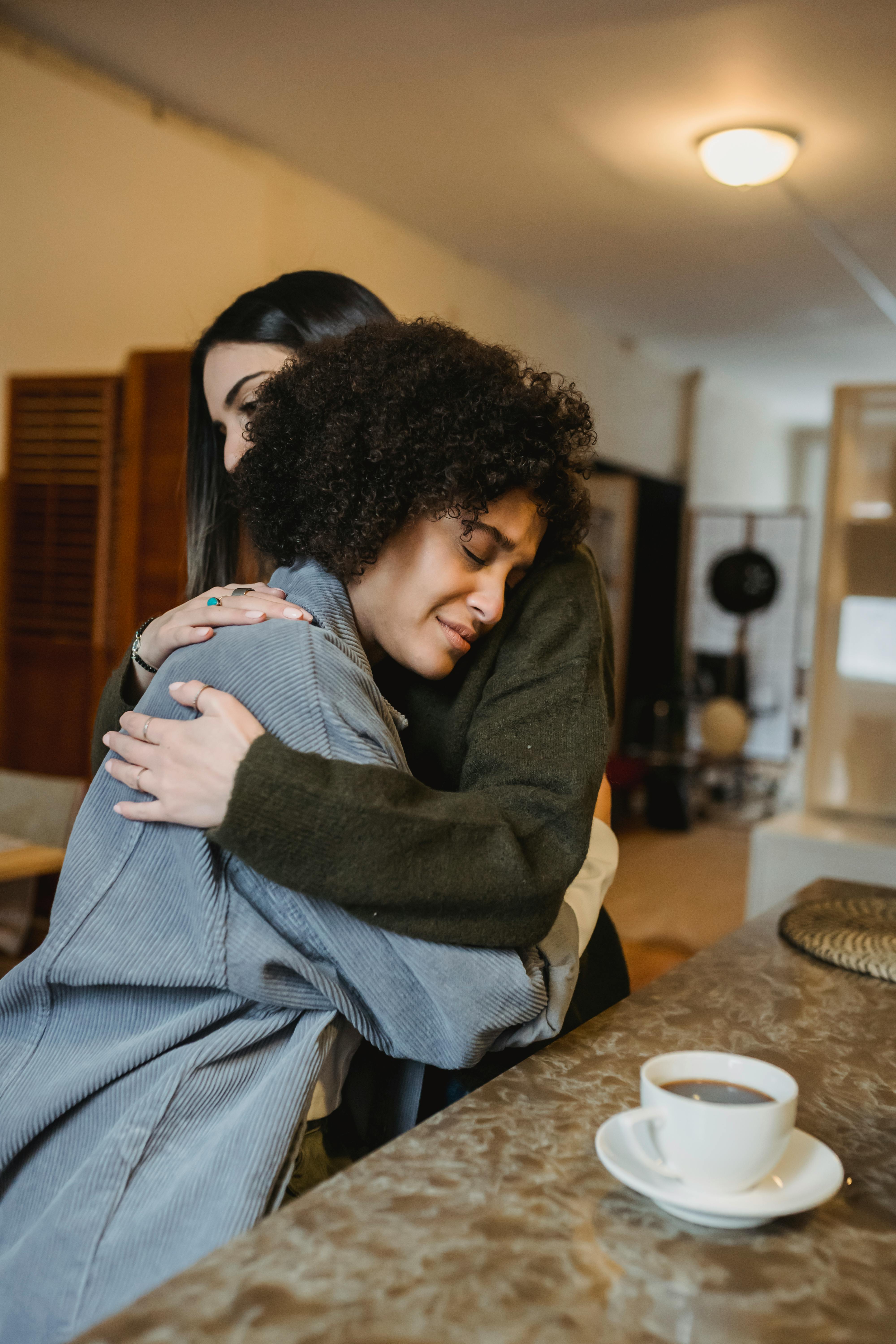 Kind woman comforting black upset girlfriend · Free Stock Photo