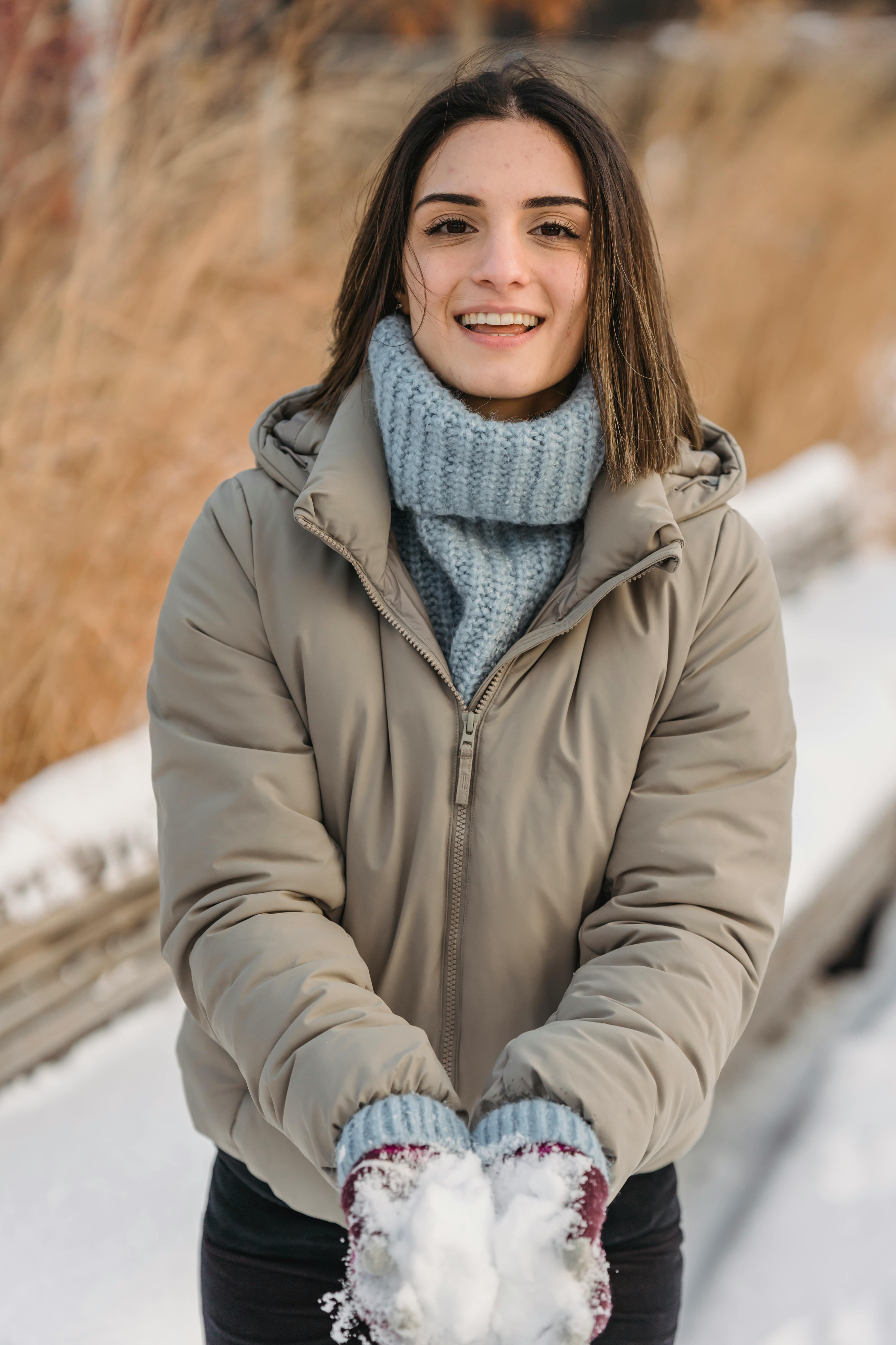 Young woman exhaling steam on freezing cold weather · Free Stock Photo